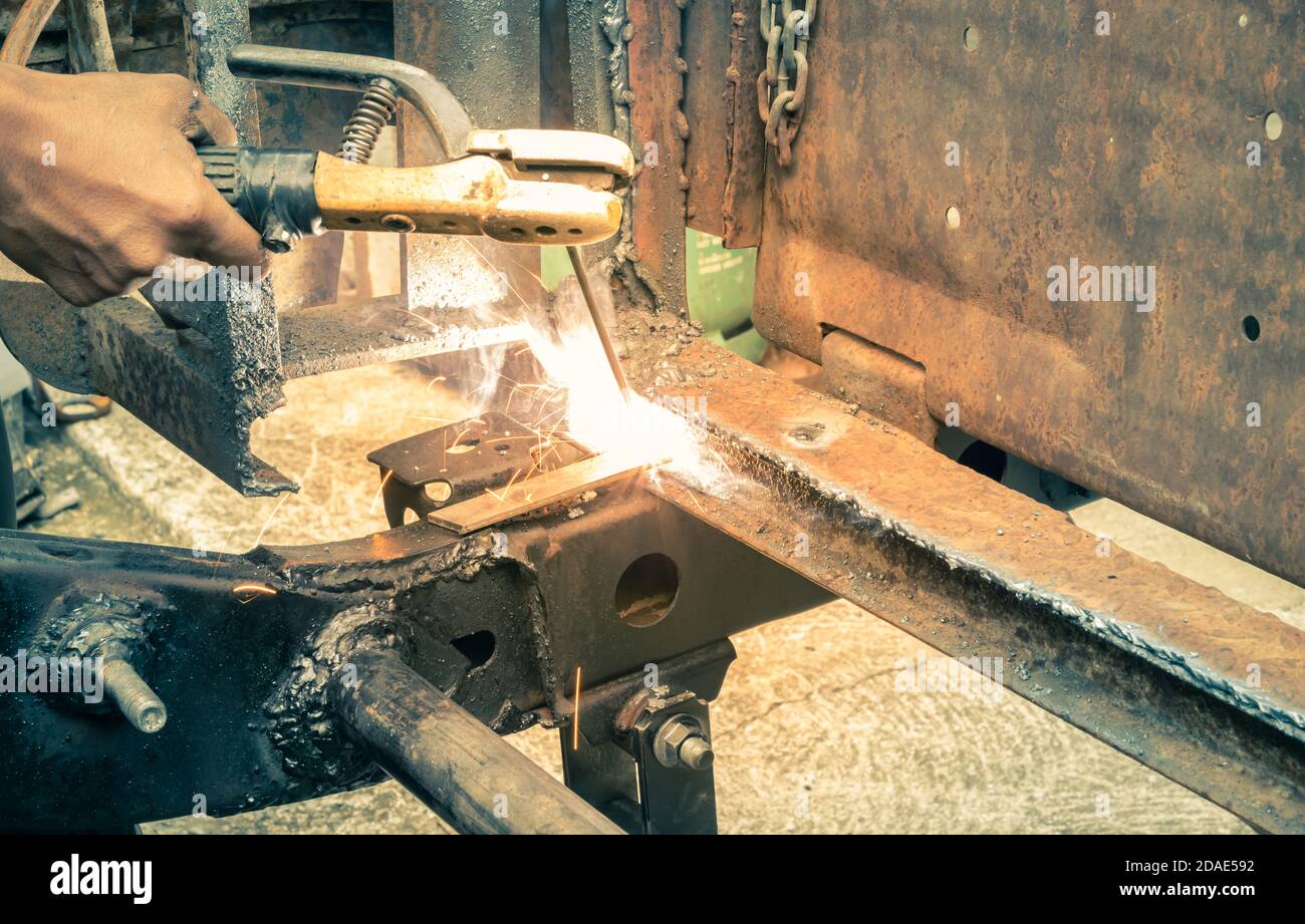 Hand of Welding Worker Welding Car Chassis or Car Metal Frame in Car ...