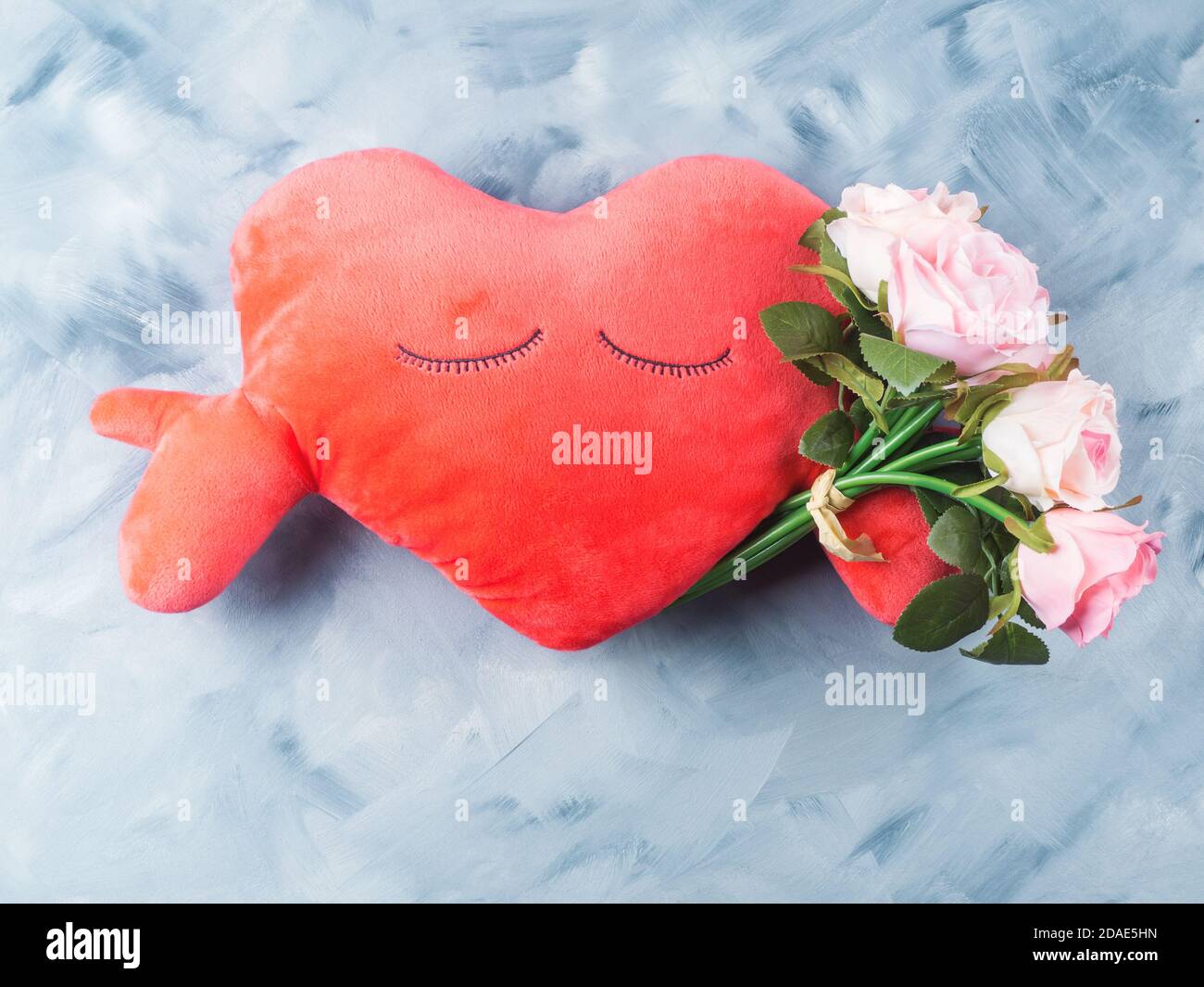 Red heart toy and flowers bouquet Stock Photo - Alamy