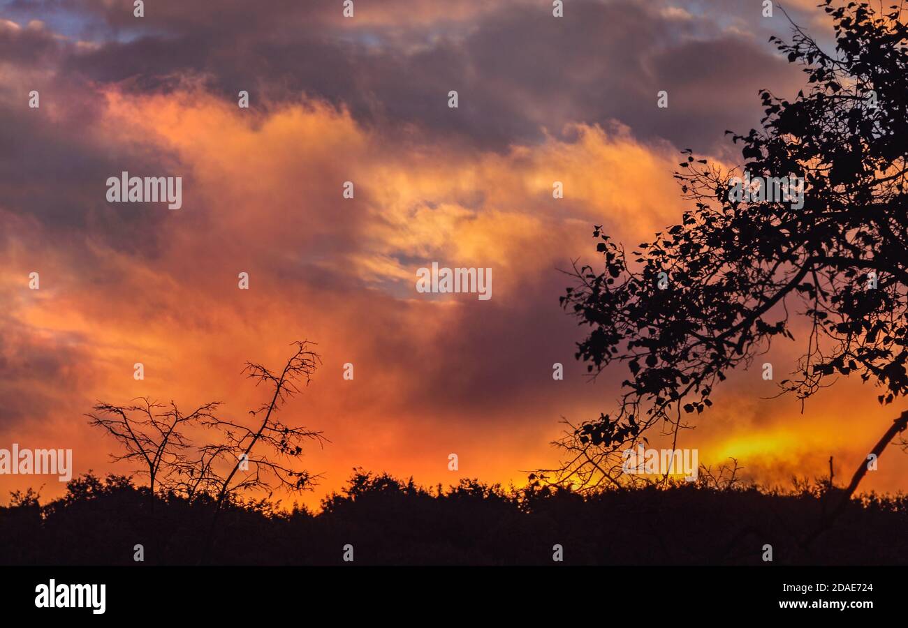 Amazing blazing sunset in pretty evening sky Stock Photo - Alamy