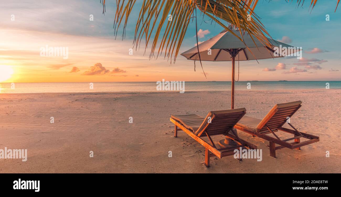 Beautiful relax beach. Chairs on the sandy beach near the sea. Summer ...