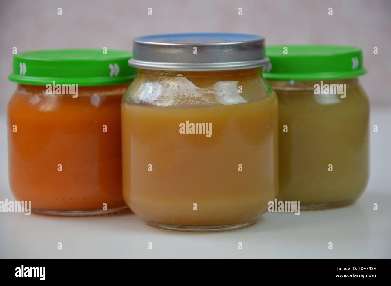 Three jars of baby food on white Stock Photo - Alamy