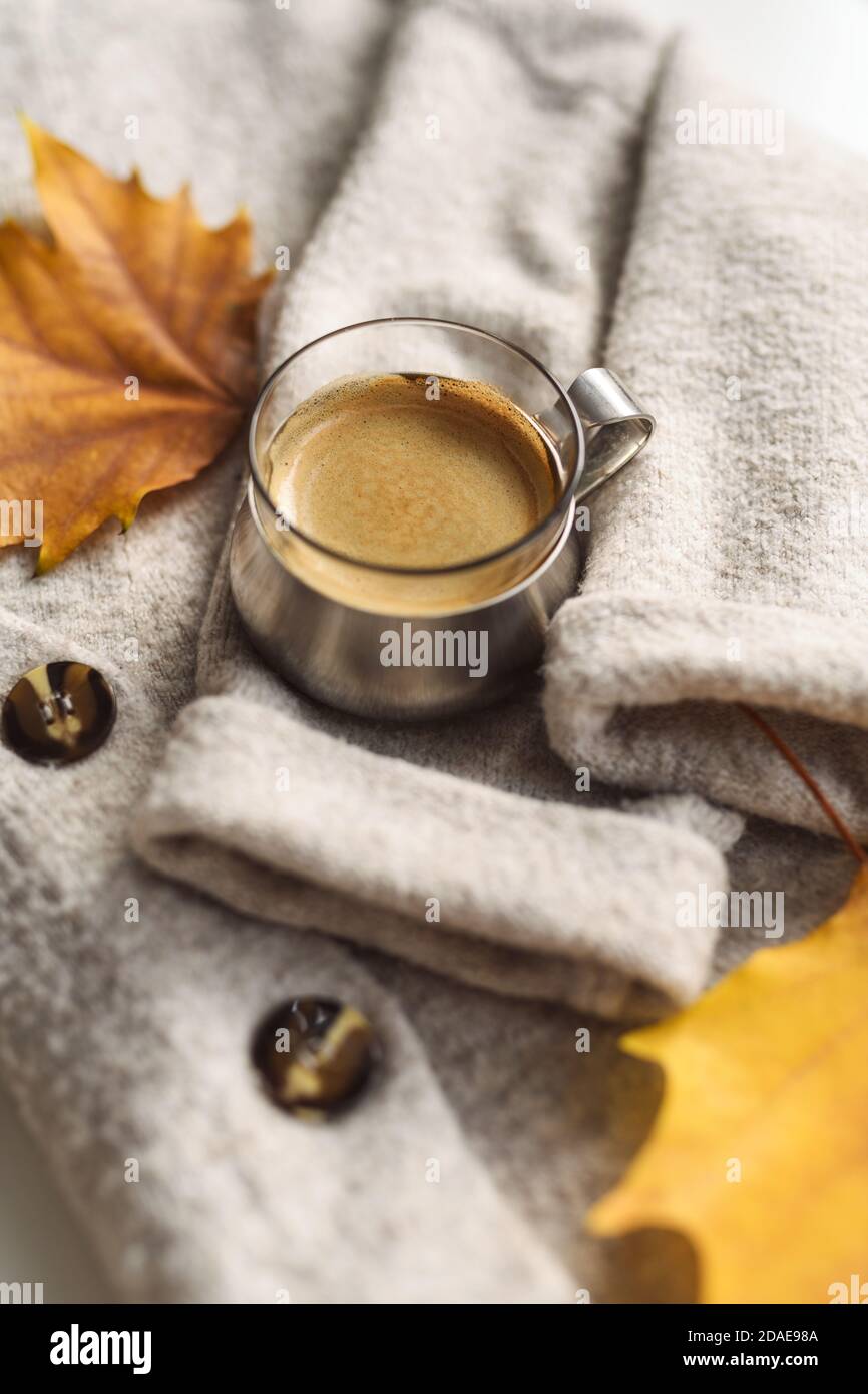 Coffee, sweater and yellow dry leaves Stock Photo - Alamy