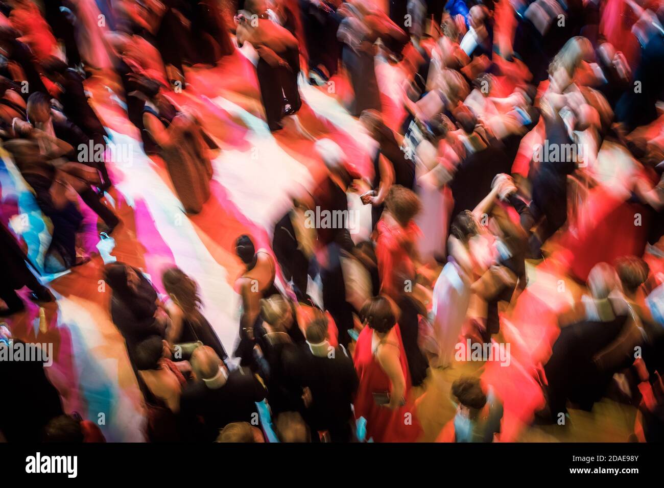 Abstract image of a large group of people dancing at a ball ...