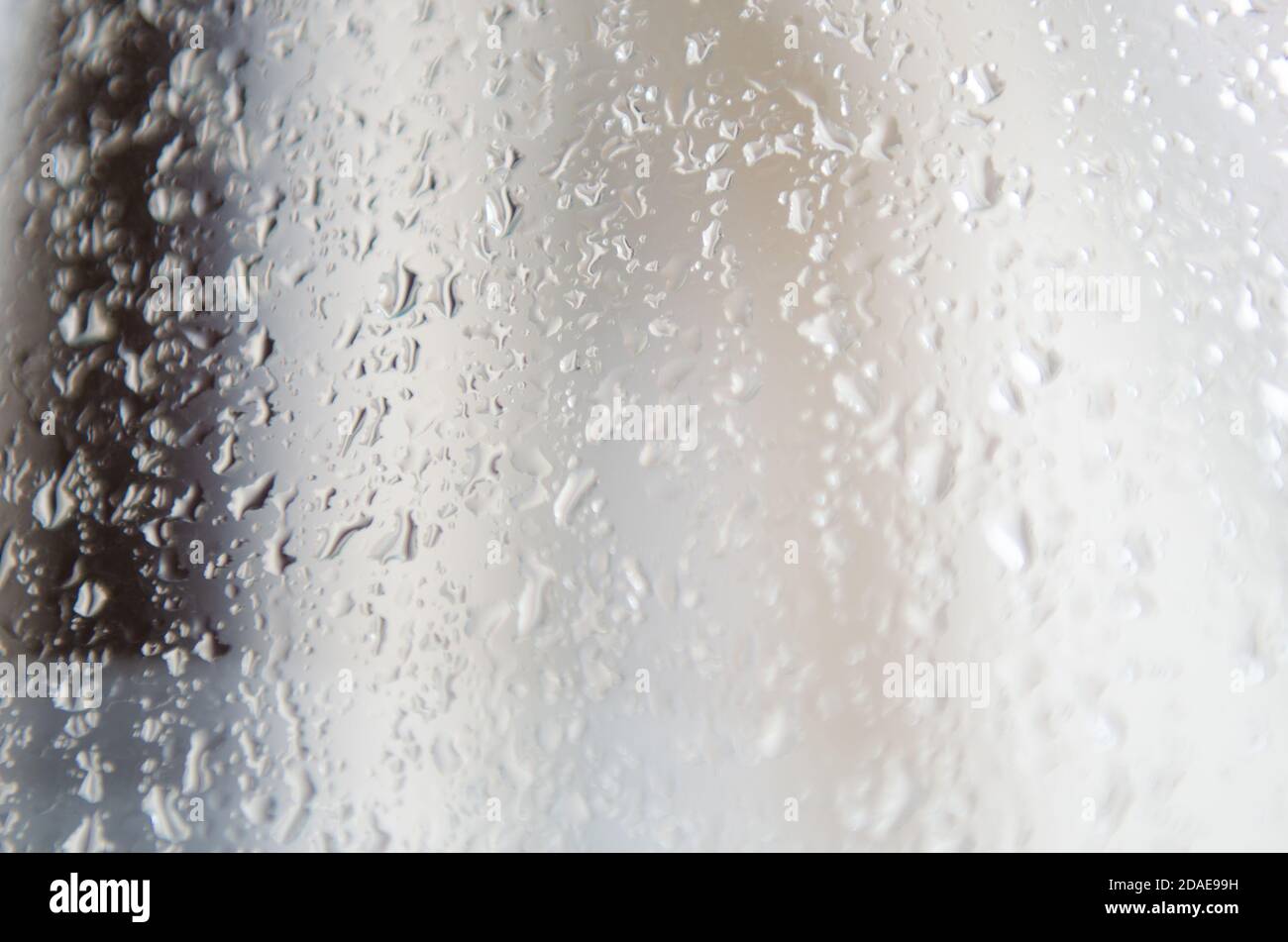 A close up shot of water droplets on a glass window pane Stock Photo ...