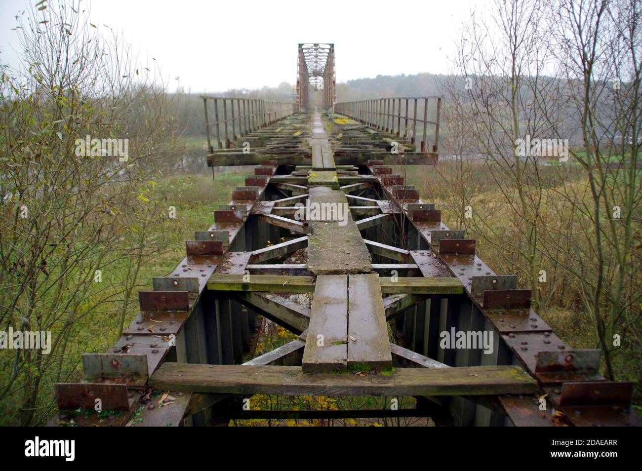 Old steel riveted bridge. Destroyed and forgotten river crossing. Old ...