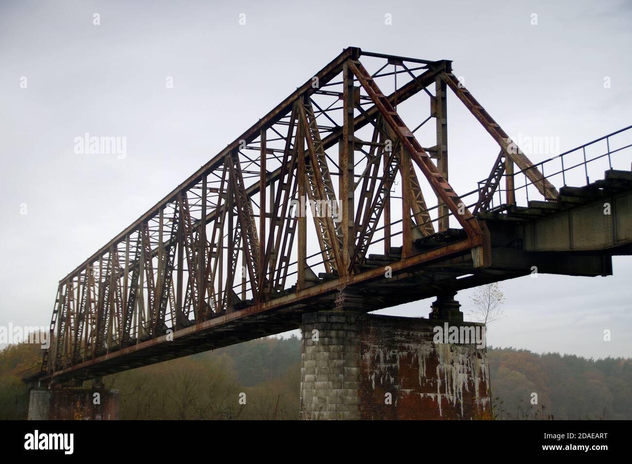 Old steel riveted bridge. Destroyed and forgotten river crossing. Old ...