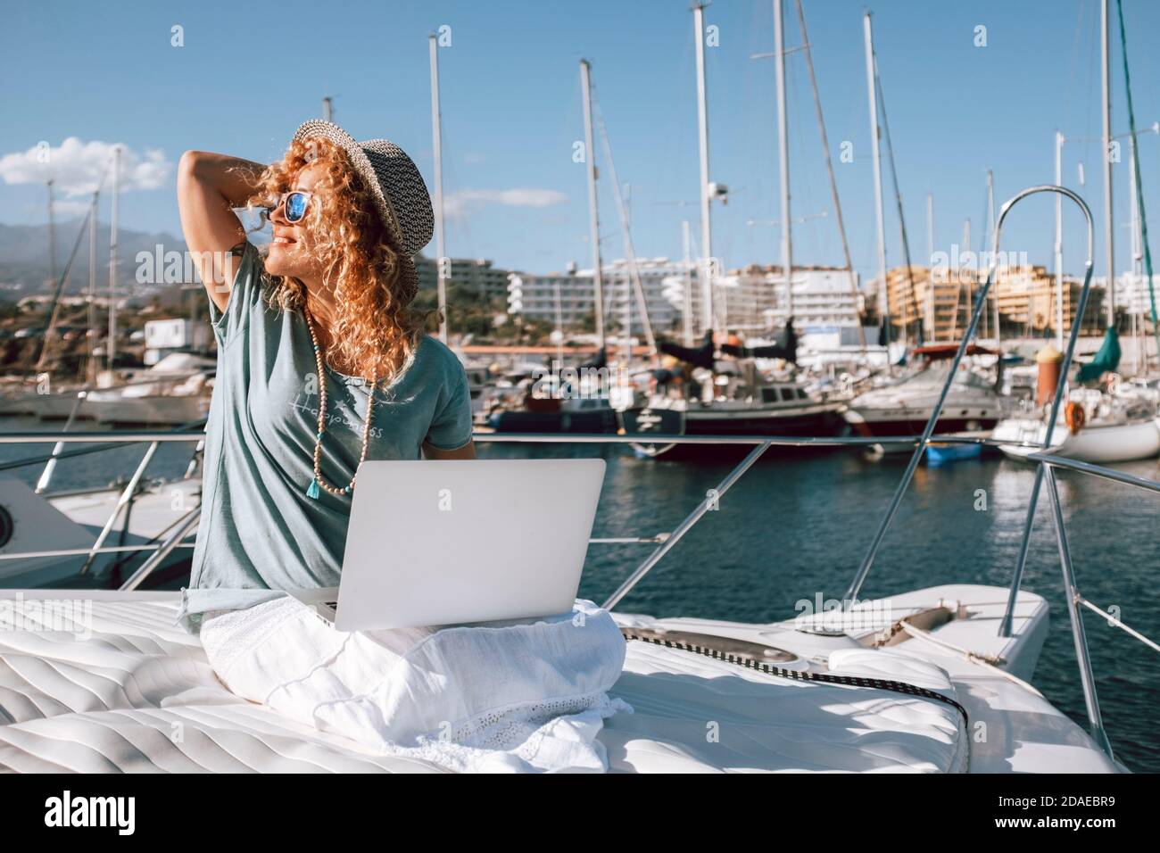 Beautiful young woman work with laptop computer in alternative office ...