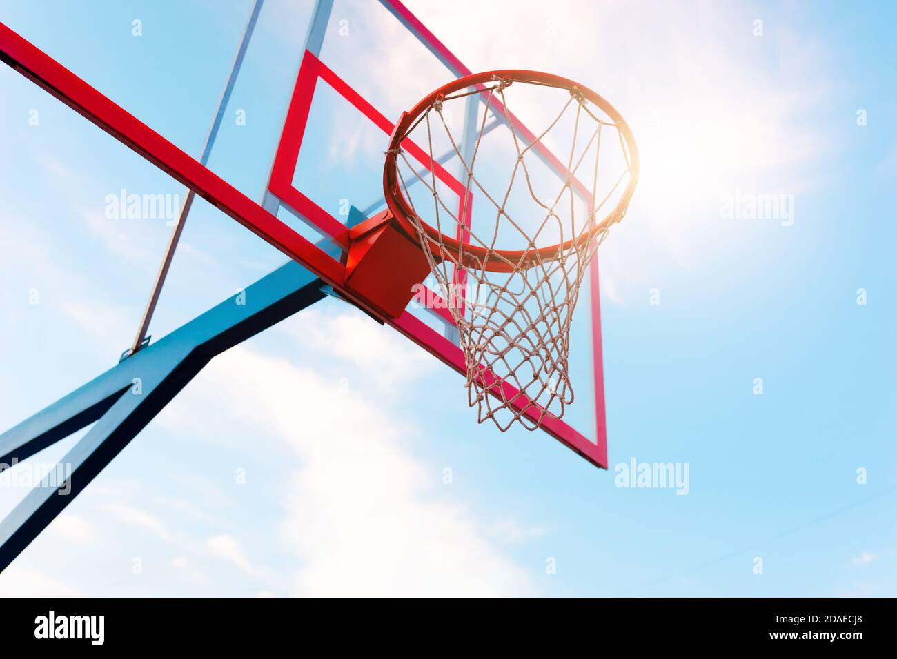 Basketball hoop on blue sky background Stock Photo - Alamy