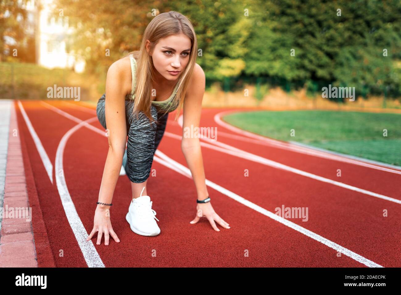 Slender girl getting ready to run Stock Photo - Alamy