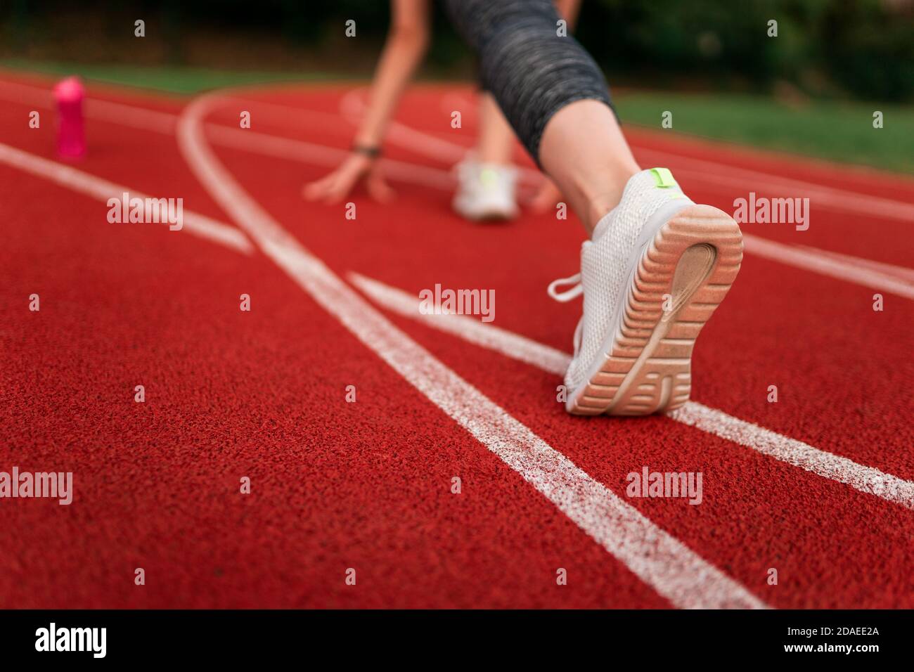 Runner feet in the stadium track Stock Photo - Alamy