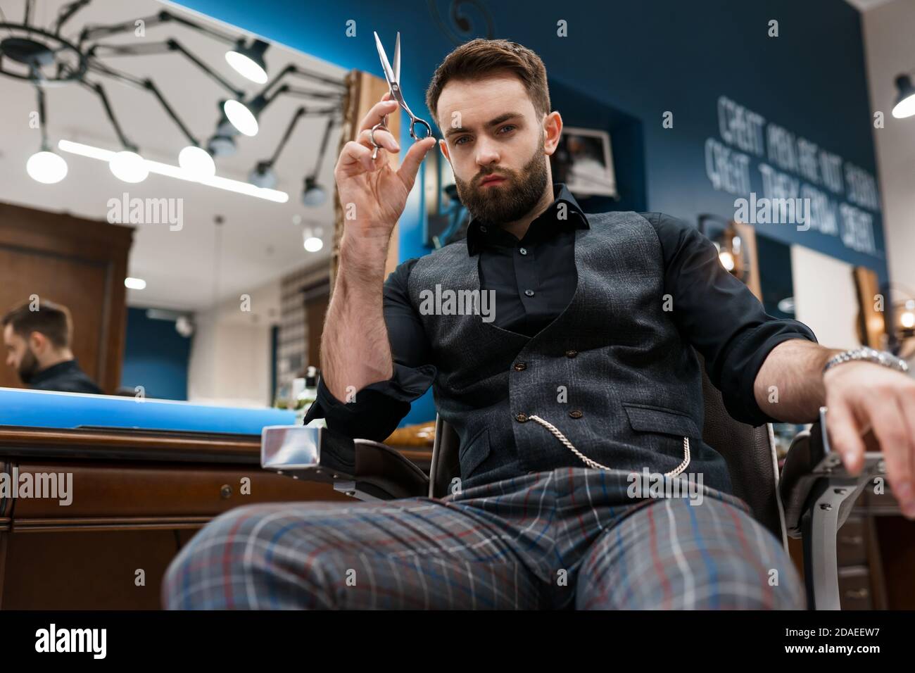 Handsome male hairdresser with scissors in hands Stock Photo - Alamy