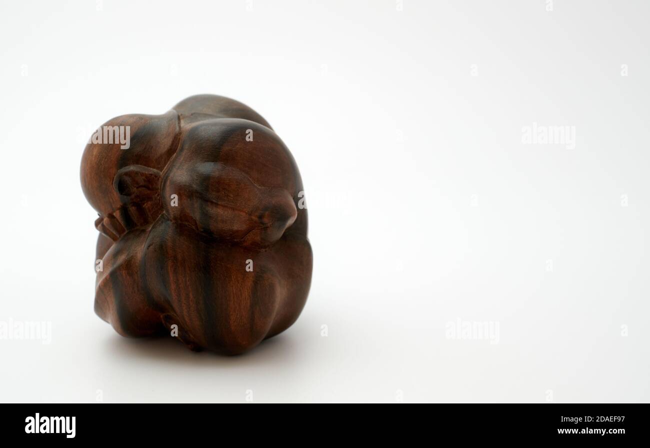 Side view Wooden buddha statue. The weeping buddha on white background ...