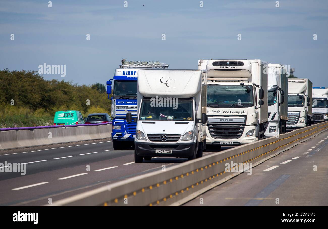 Lorries travelling alongside roadworks on the M1 motorway in the ...