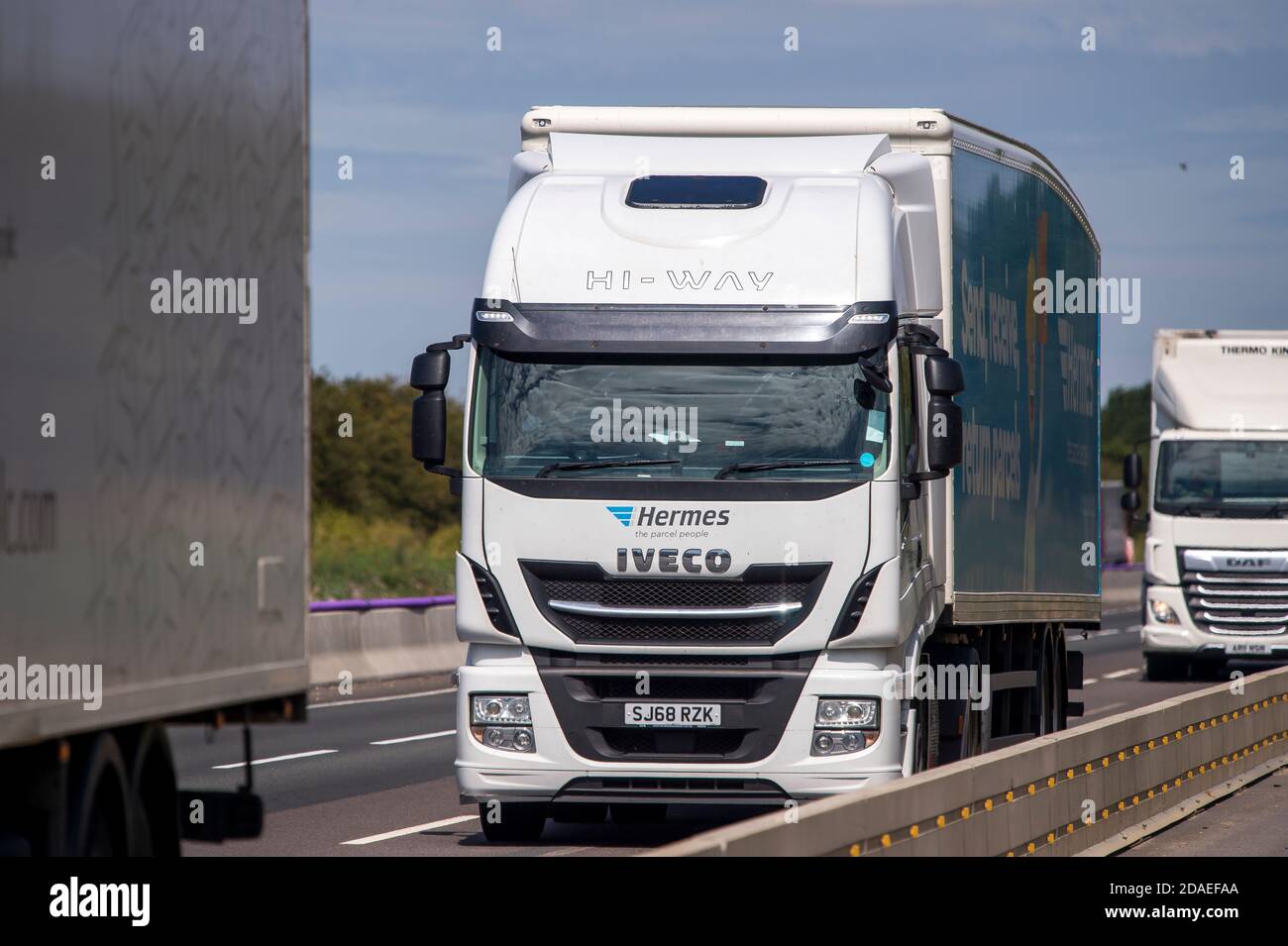 Lorries travelling alongside roadworks on the M1 motorway in the ...