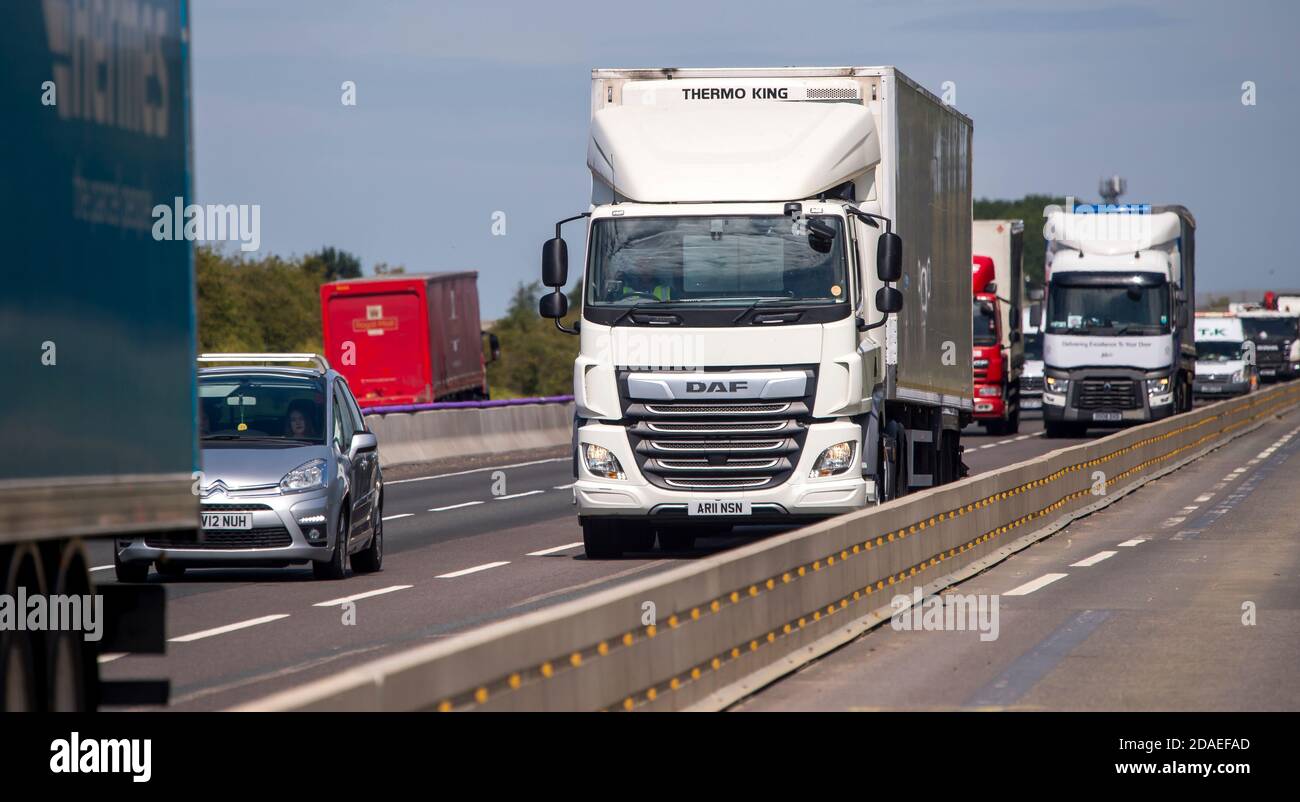 Lorries travelling alongside roadworks on the M1 motorway in the ...