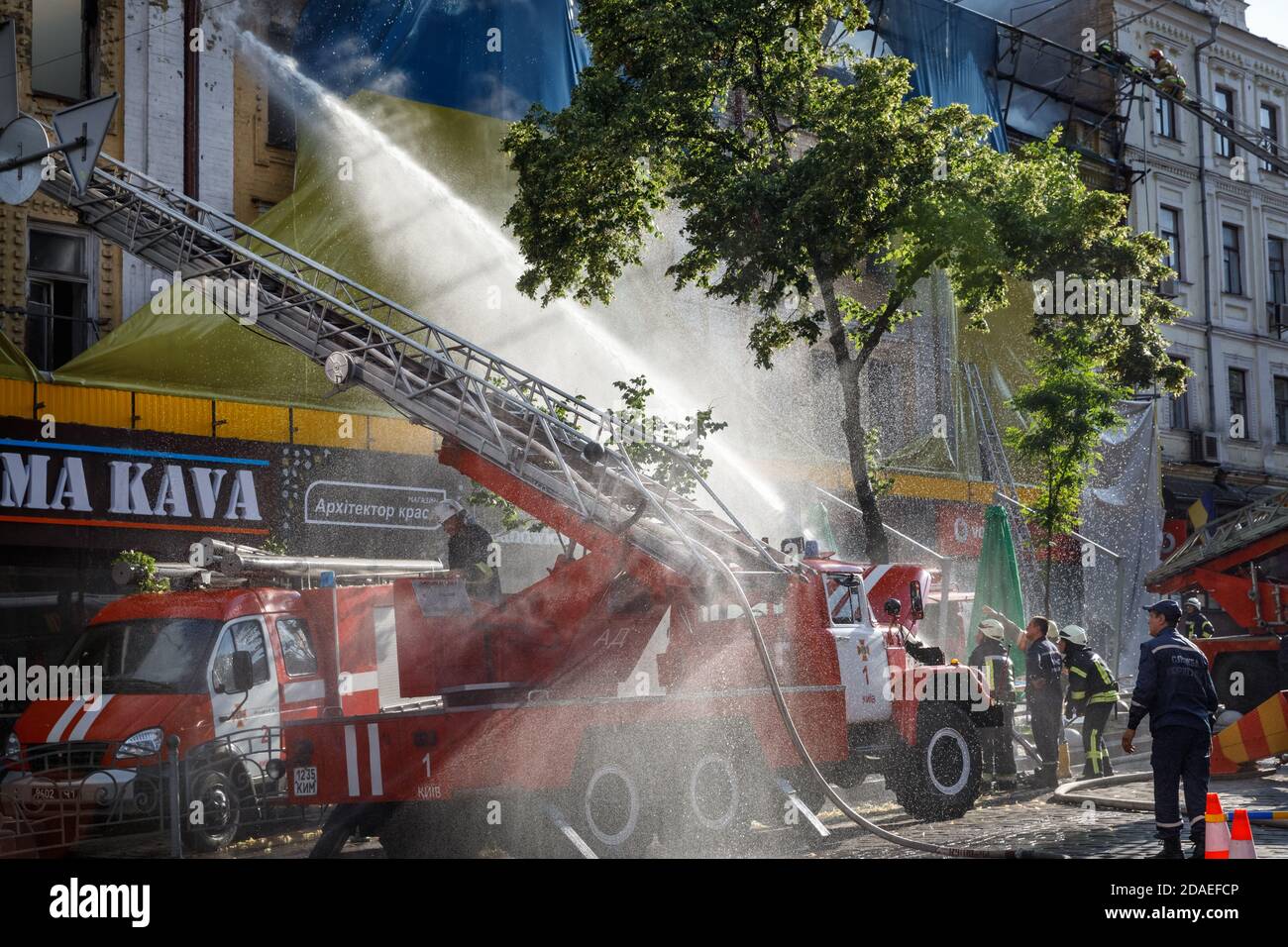 KIEV, UKRAINE - Jun 20, 2017: Ukrainian firefighters try to extinguish ...