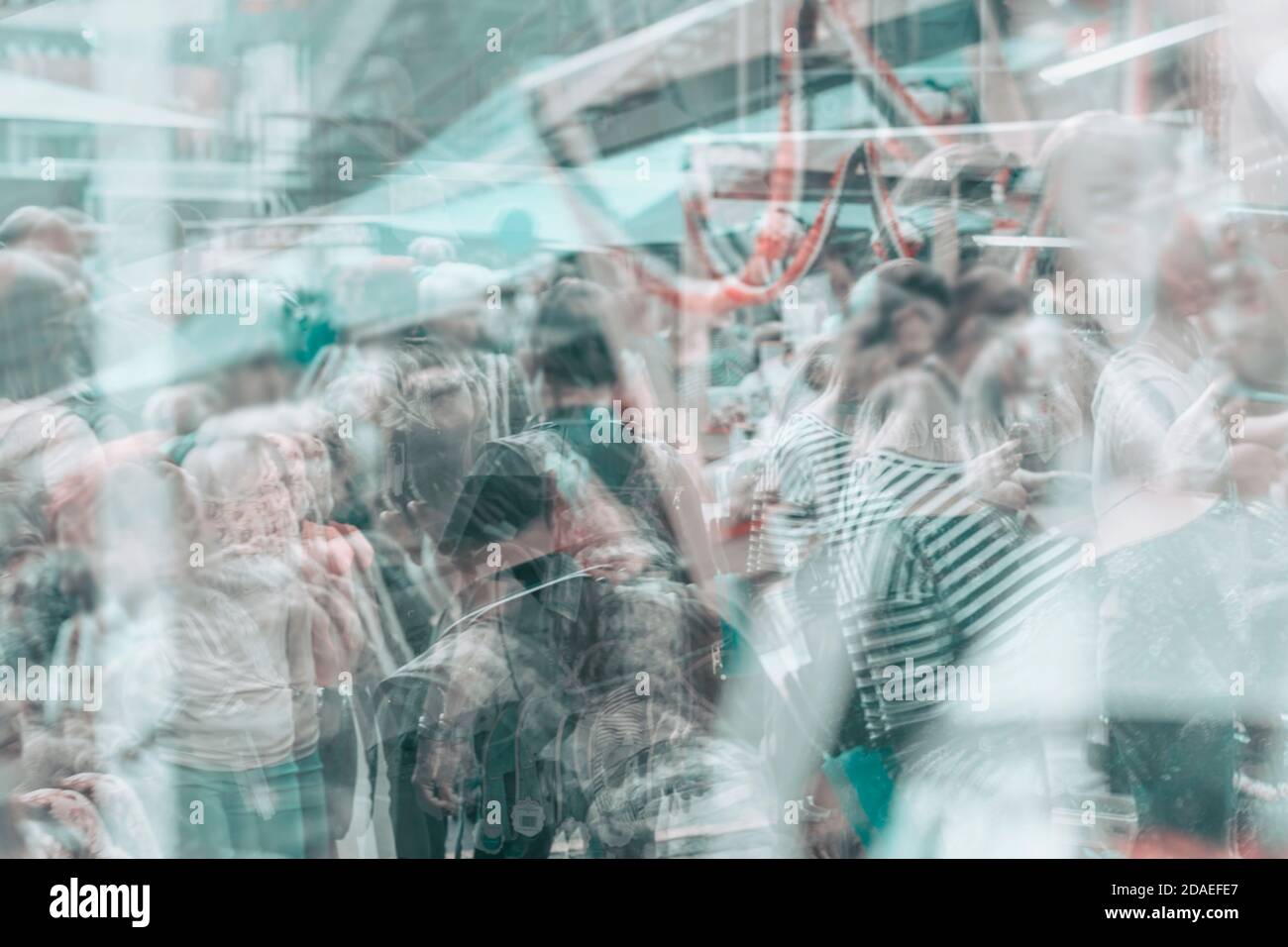 Abstract blurred large crowd at a trade fair, walking in the shopping ...