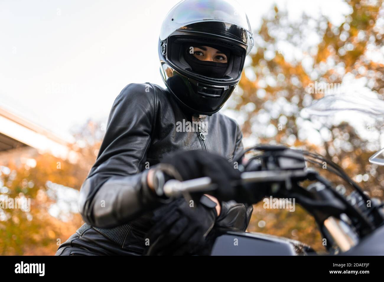 Female motorcyclist in helmet hi-res stock photography and images - Alamy