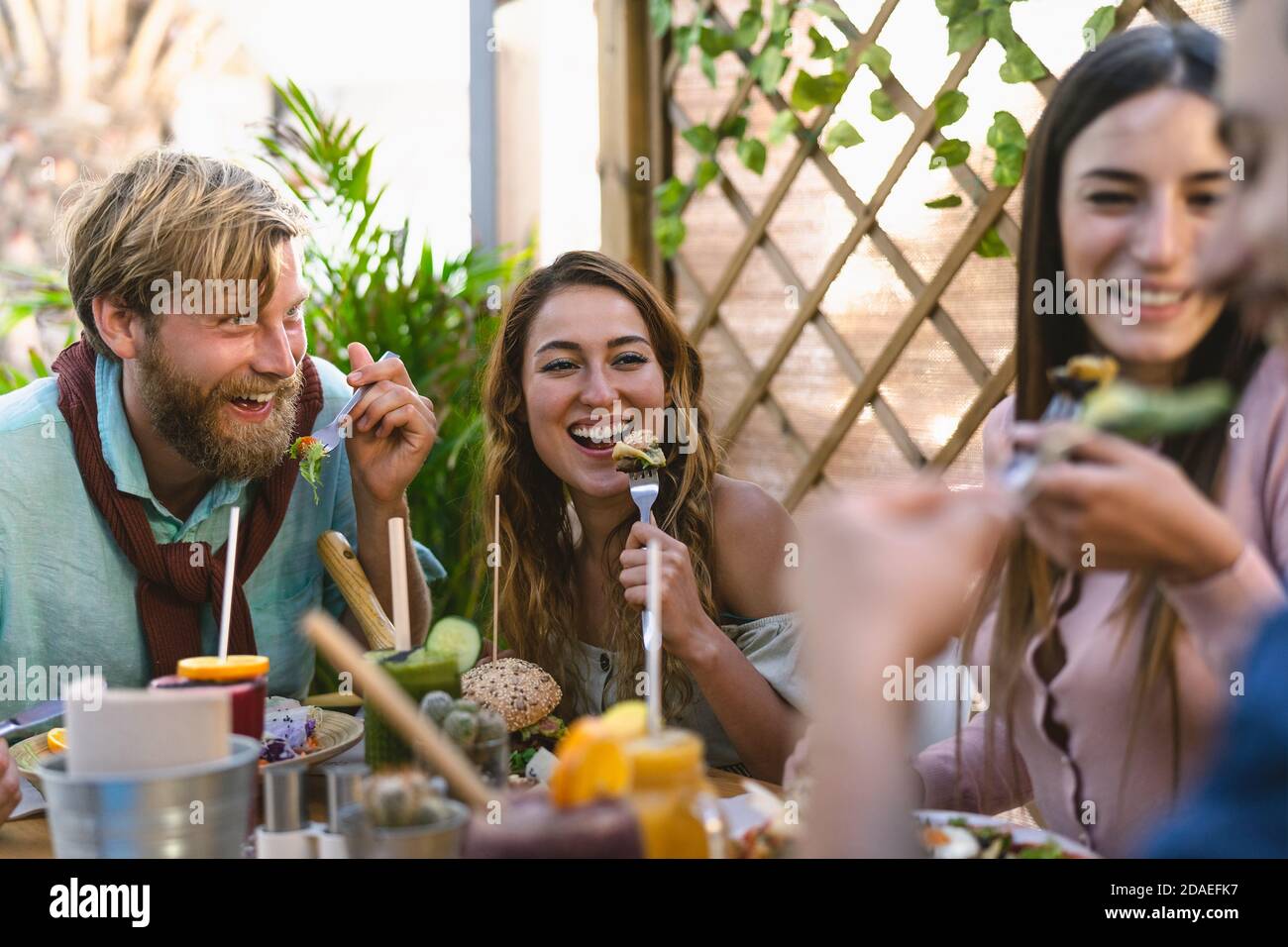 Happy friends lunching with healthy food in bar coffee brunch - Young ...