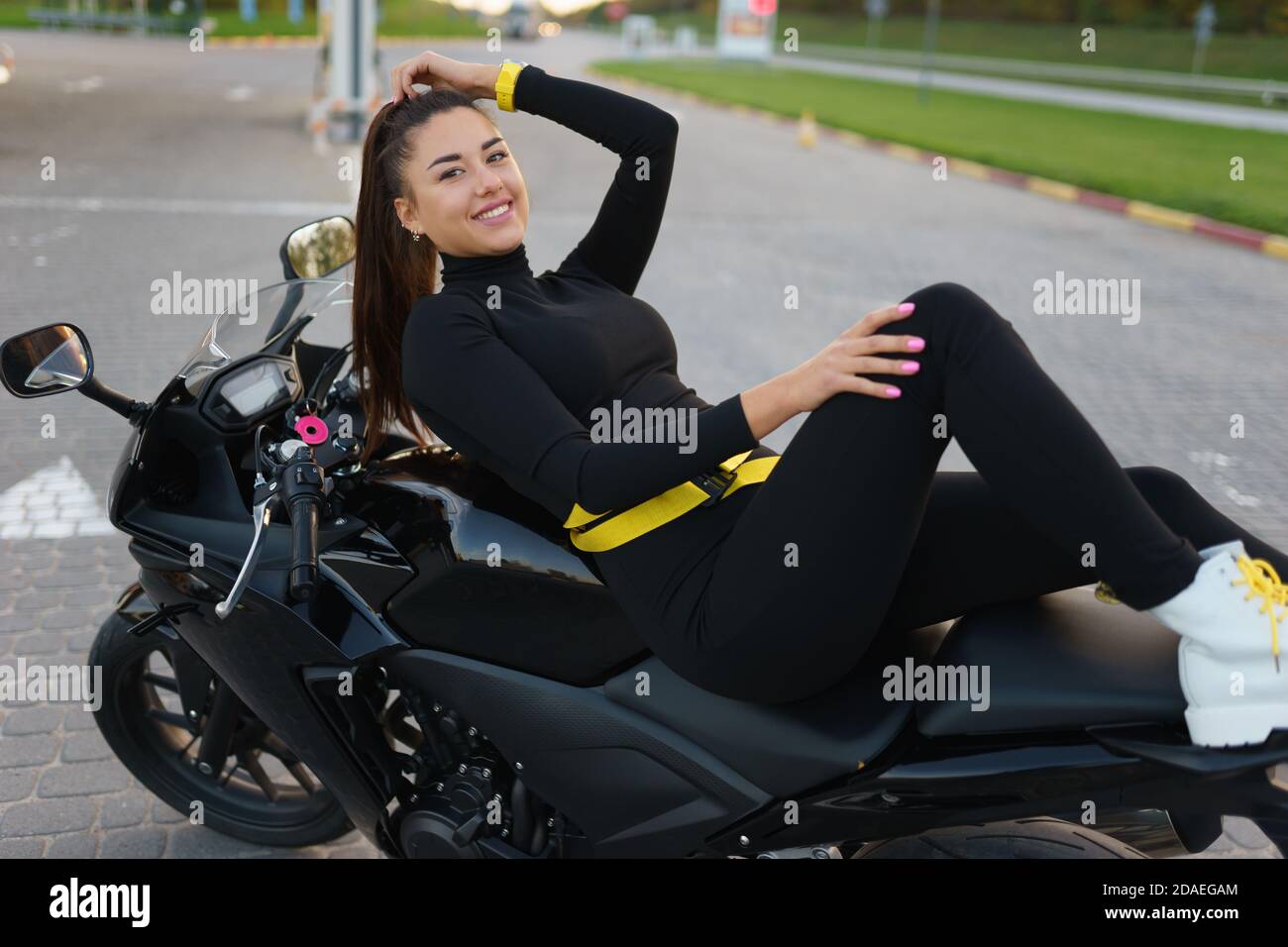 Stylish biker girl on motorcycle Stock Photo - Alamy