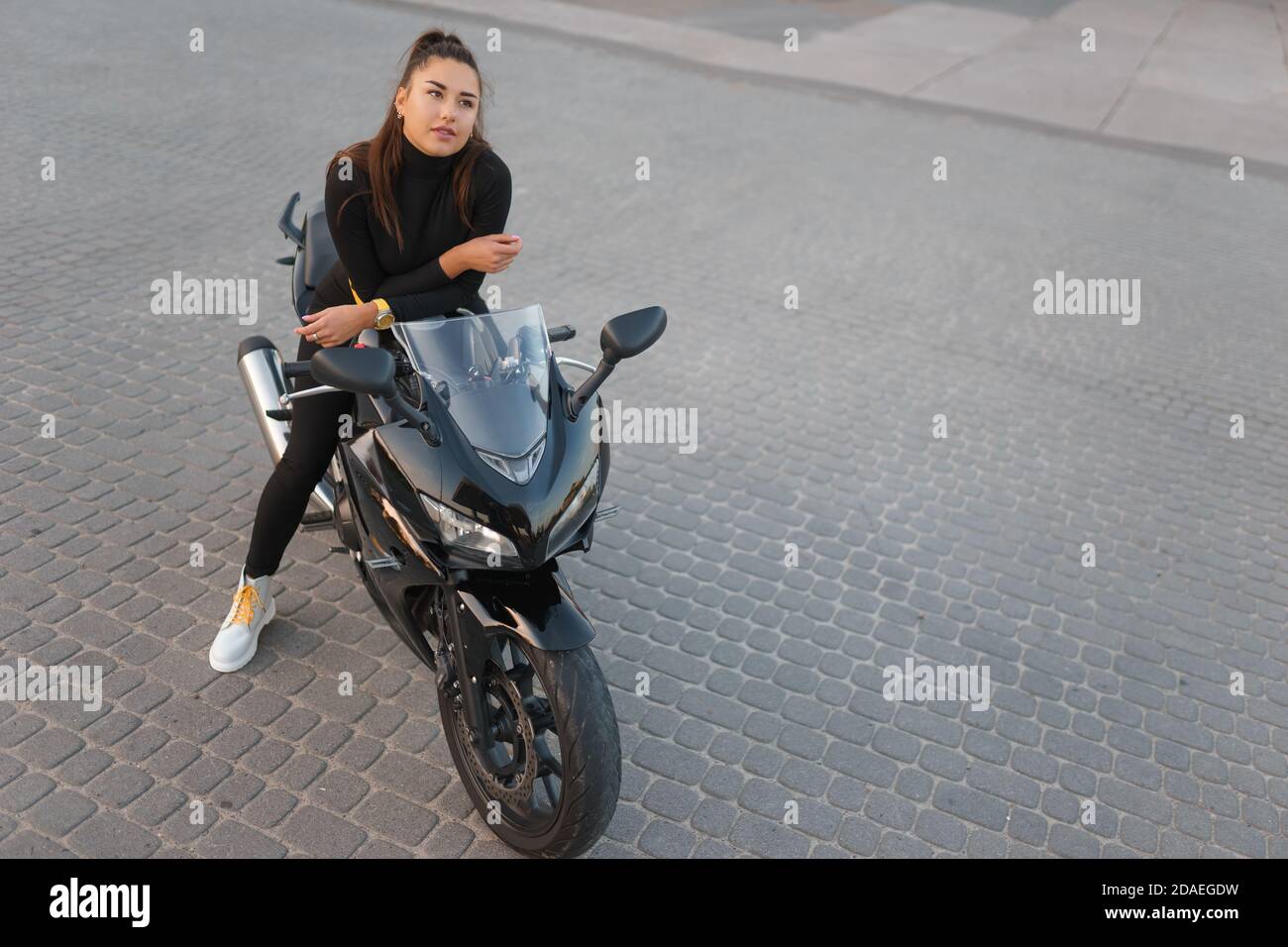 Stylish biker girl on motorcycle Stock Photo - Alamy