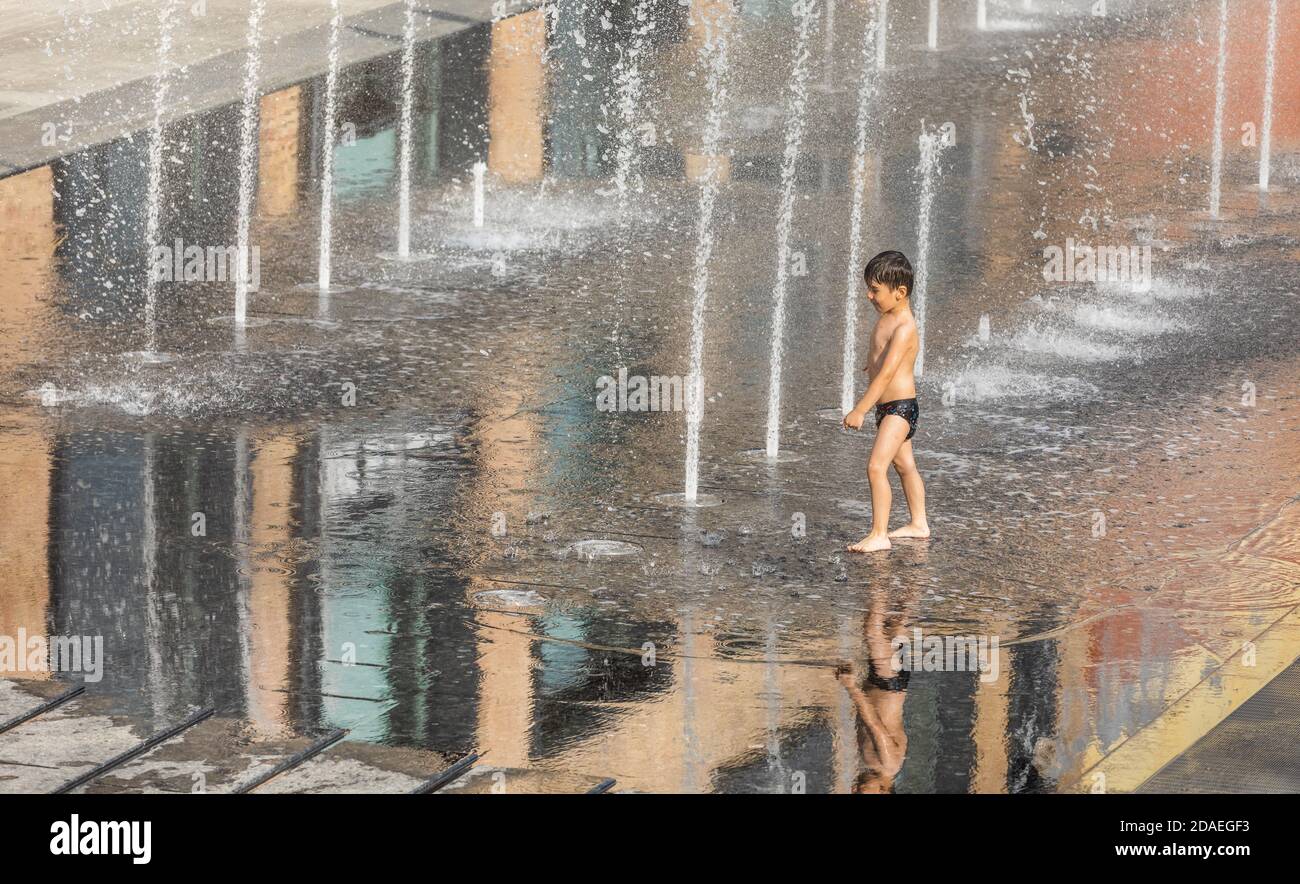 KYIV, UKRAINE - Jul. 29, 2020: Children playing in a water fountain and ...