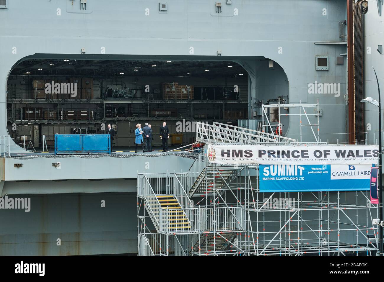 Officers show visitors around the cavernous interior of the Royal Navy ...