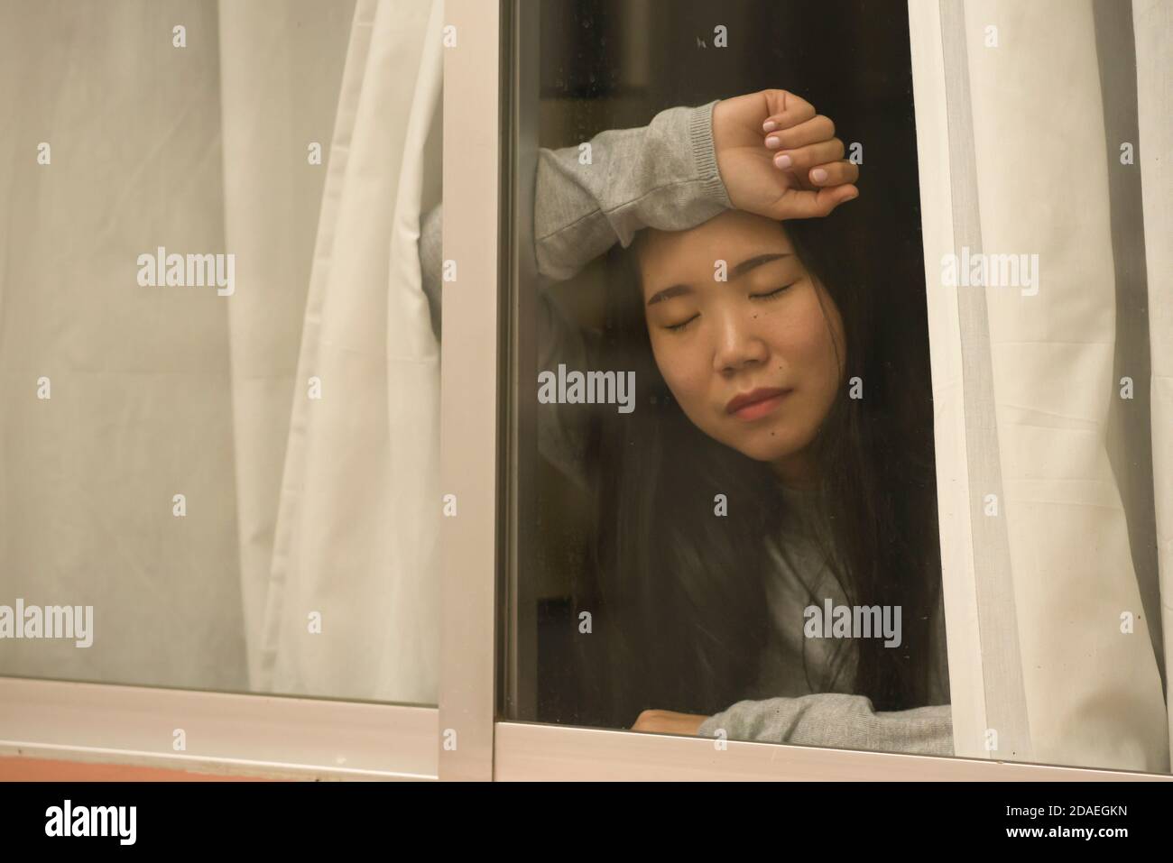 young sad and depressed Asian Japanese girl scared and worried during ...