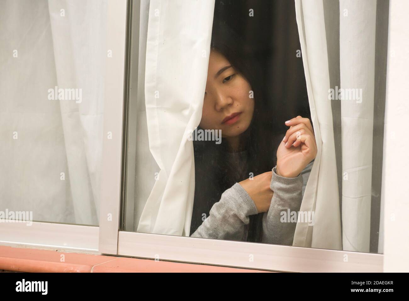 young sad and depressed Asian Japanese girl scared and worried during ...