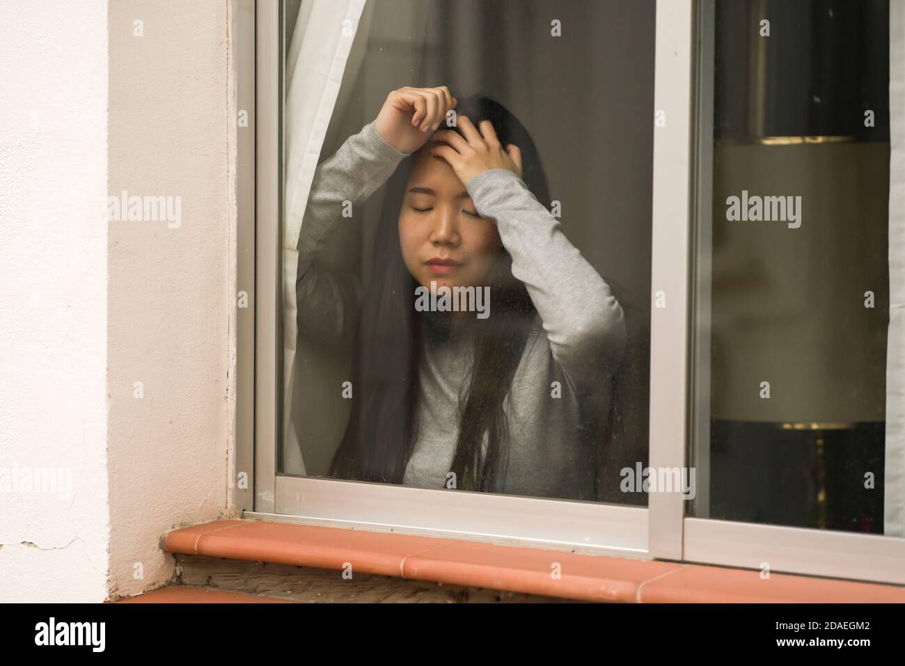 young sad and depressed Asian Japanese girl scared and worried during ...