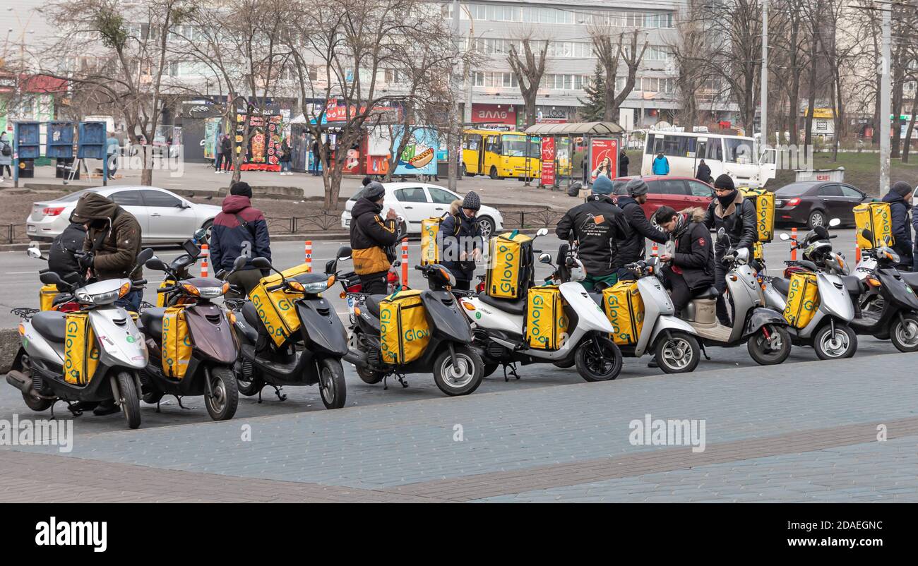 Kyiv, Ukraine - Mar. 20, 2020: A Glovo food delivery couriers delivers ...