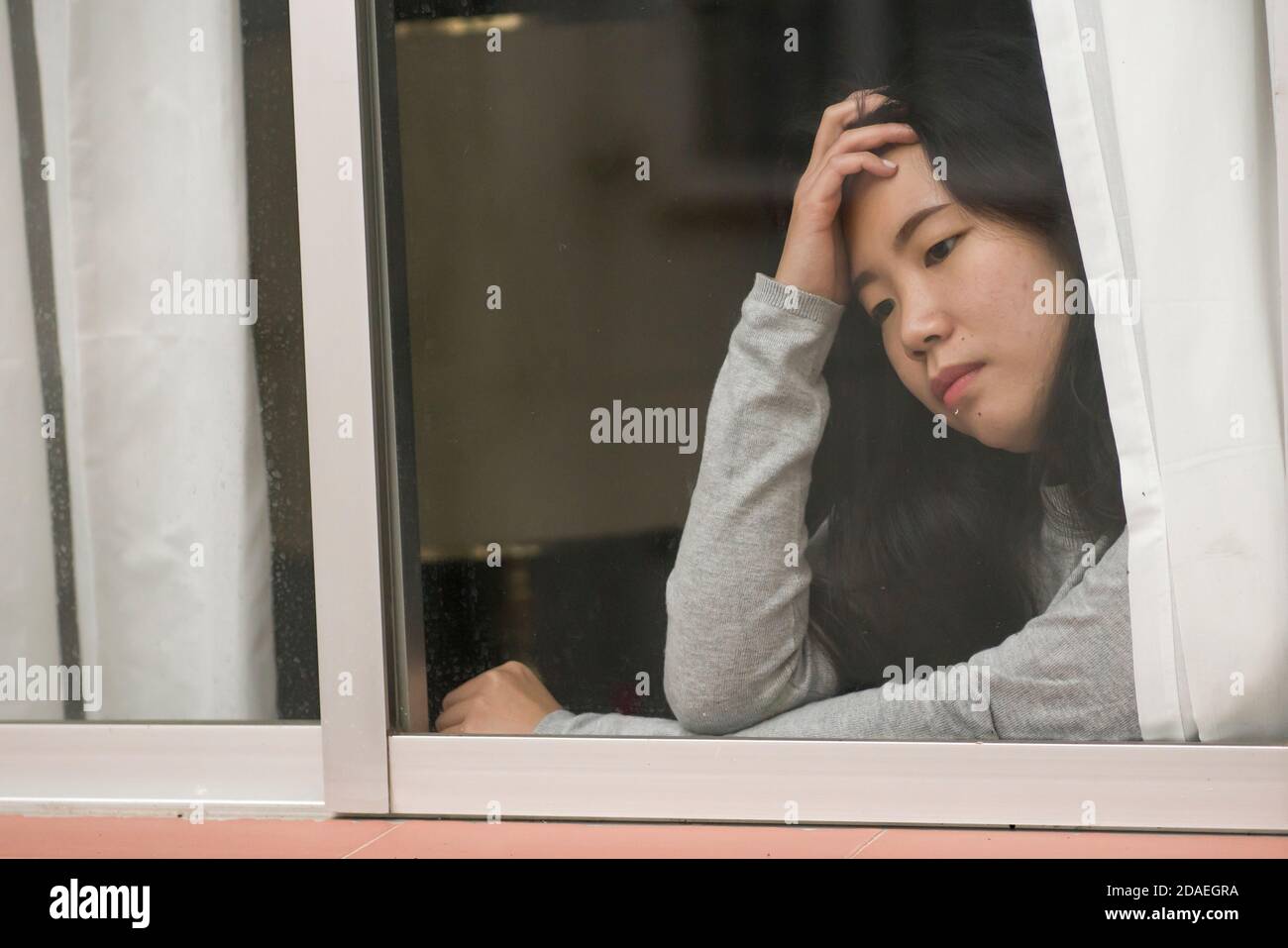 young sad and depressed Asian Japanese girl scared and worried during ...