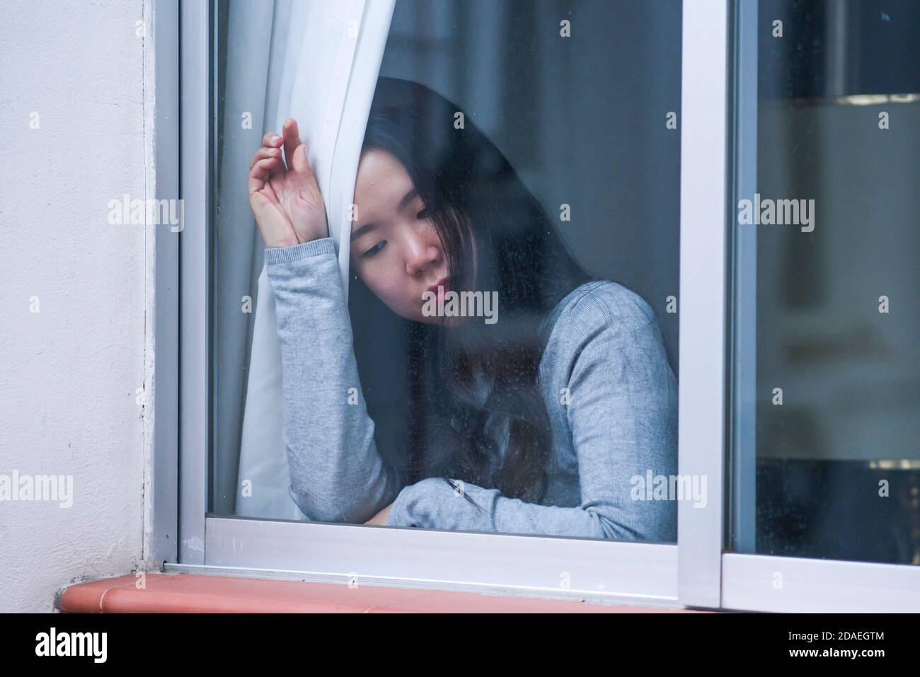 young sad and depressed Asian Japanese girl scared and worried during ...