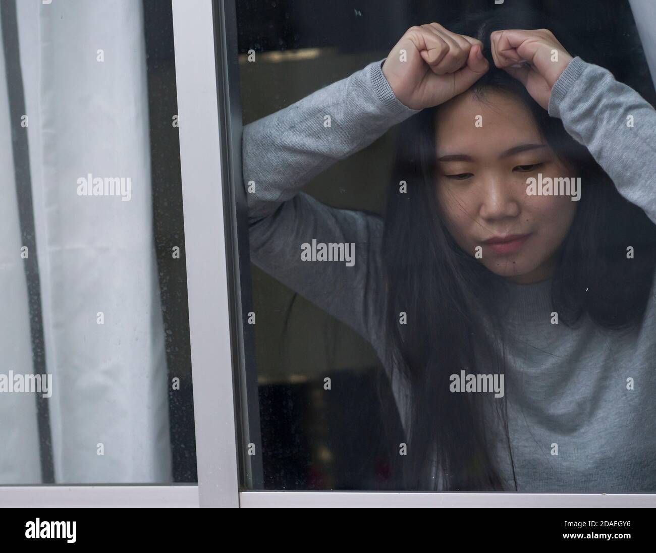 young sad and depressed Asian Japanese girl scared and worried during ...