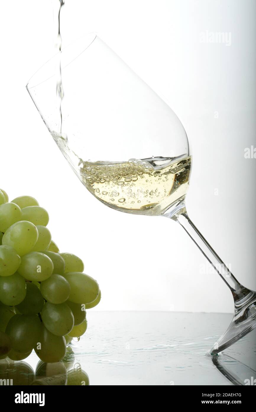 White wine pouring into wine glass in Prague, March 16, 2008. (CTK ...