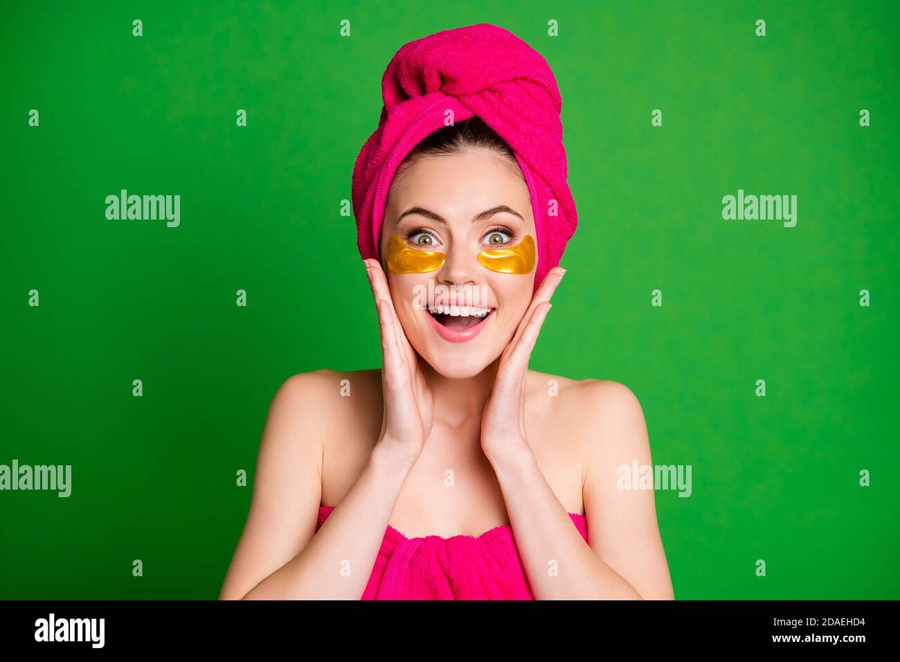Excited lady use under eyes patches look mirror arms touch cheekbones ...