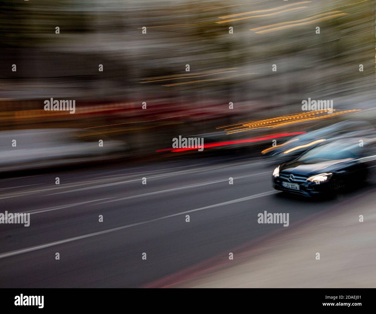 Long exposure image of car headlights at dusk on a London street, with ...