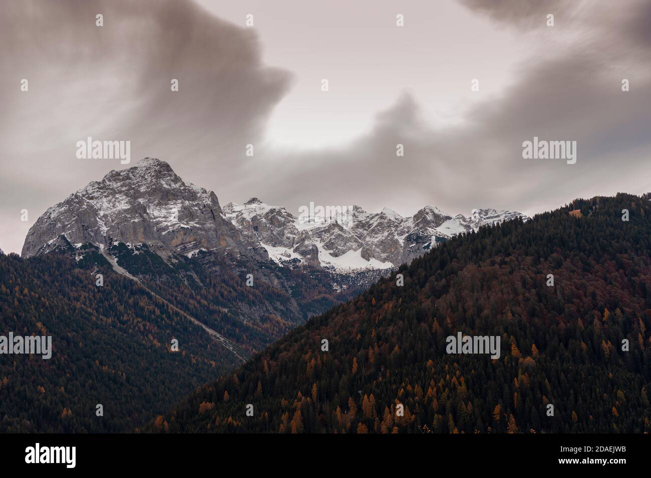 panoramic sunset views of the snowy peaks of the Italian Alps in autumn ...