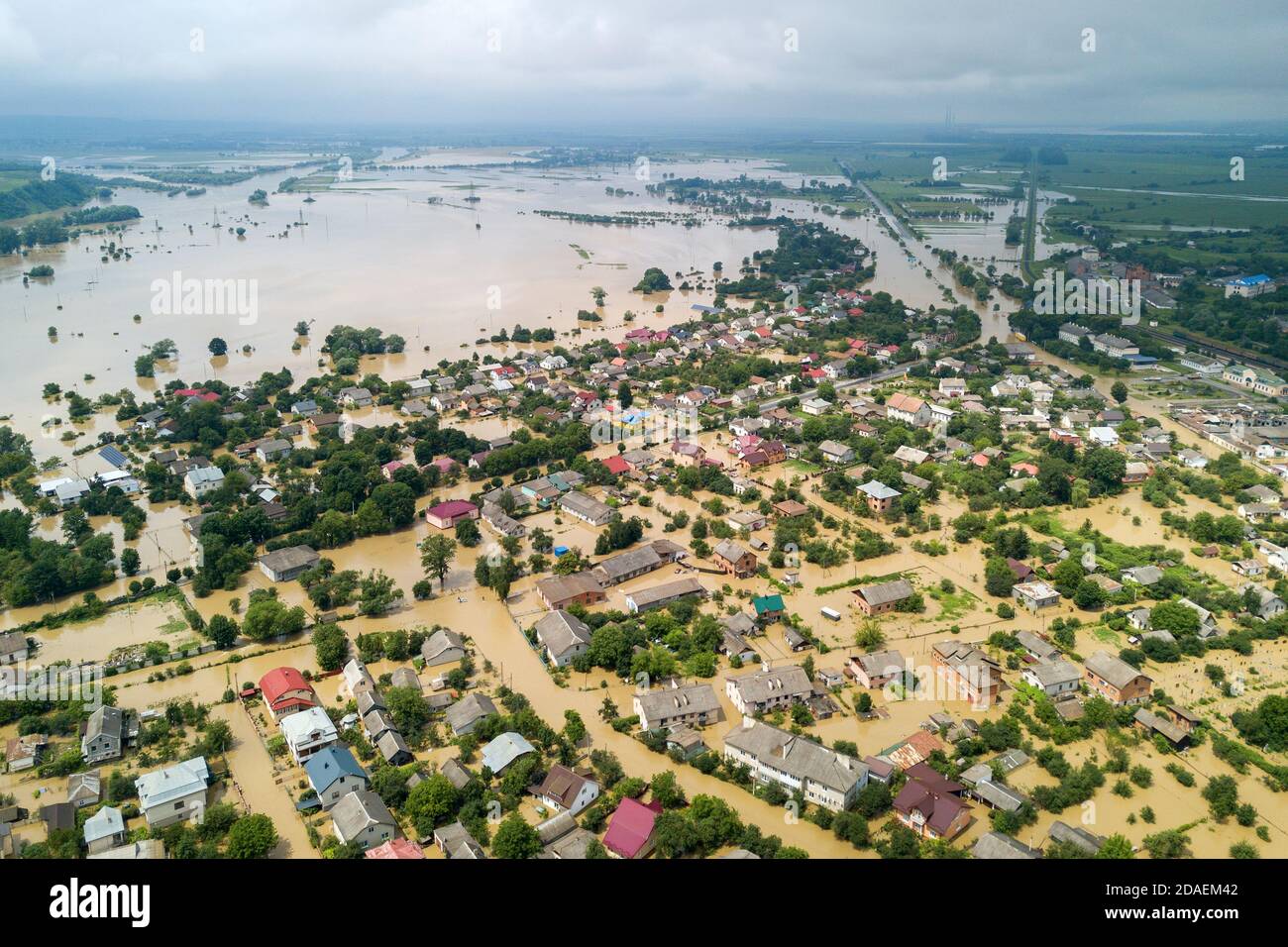 Aerial view of flooded houses with dirty water of Dnister river in Halych town, western Ukraine ...