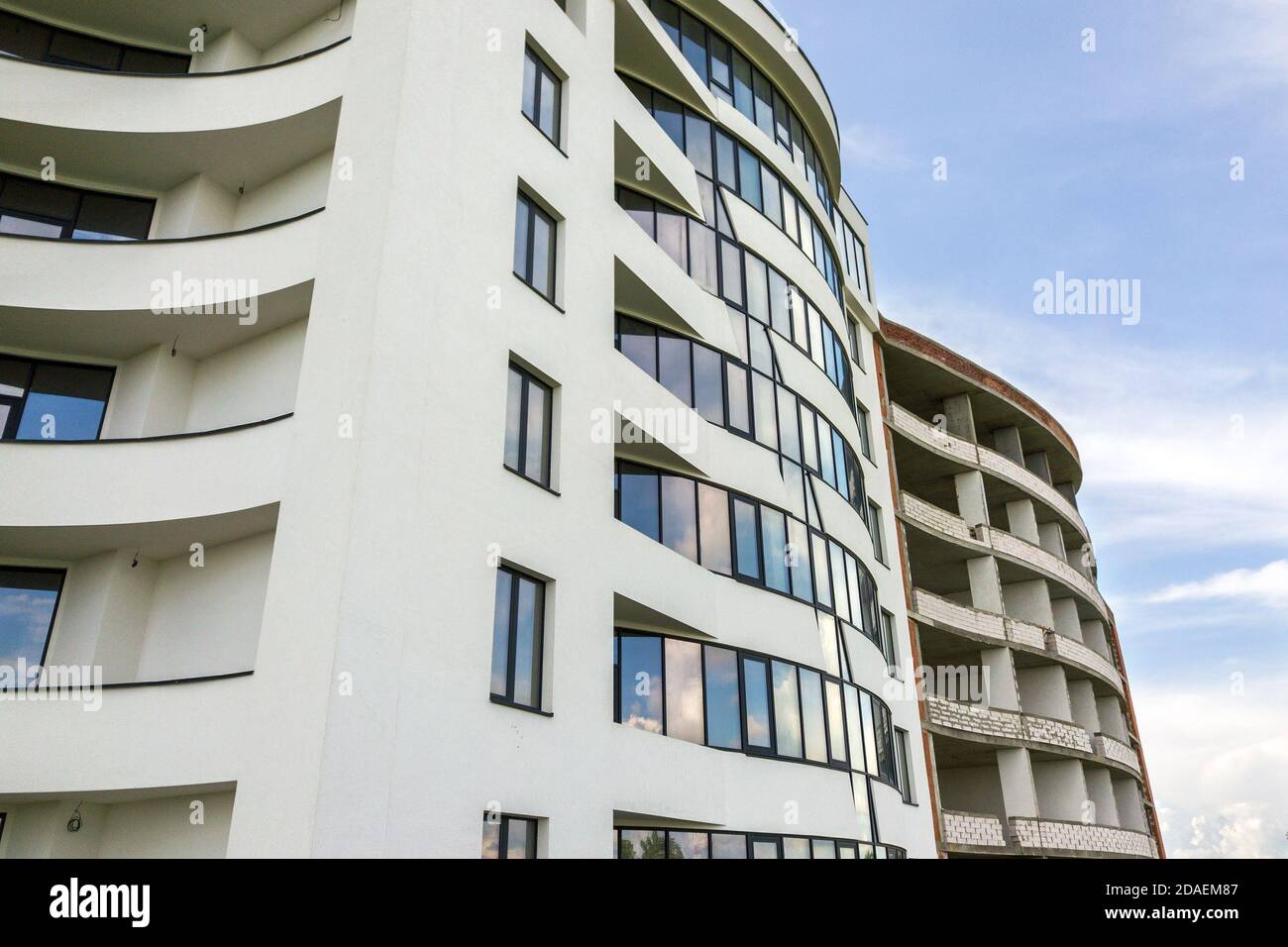 Many windows on new apartment building facade Stock Photo - Alamy