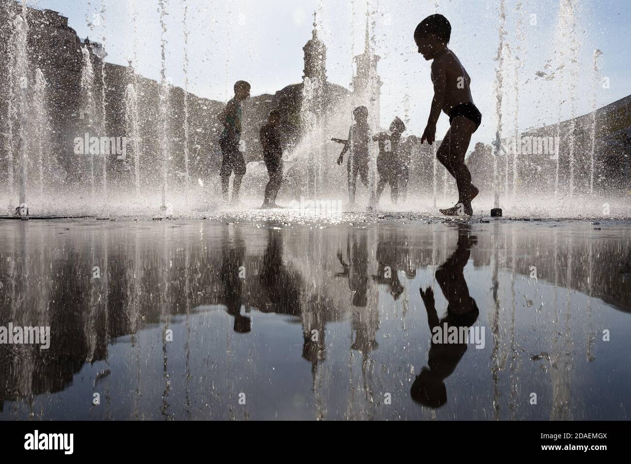 KIEV, UKRAINE - Jun 28, 2017: Happy children playing in a water ...
