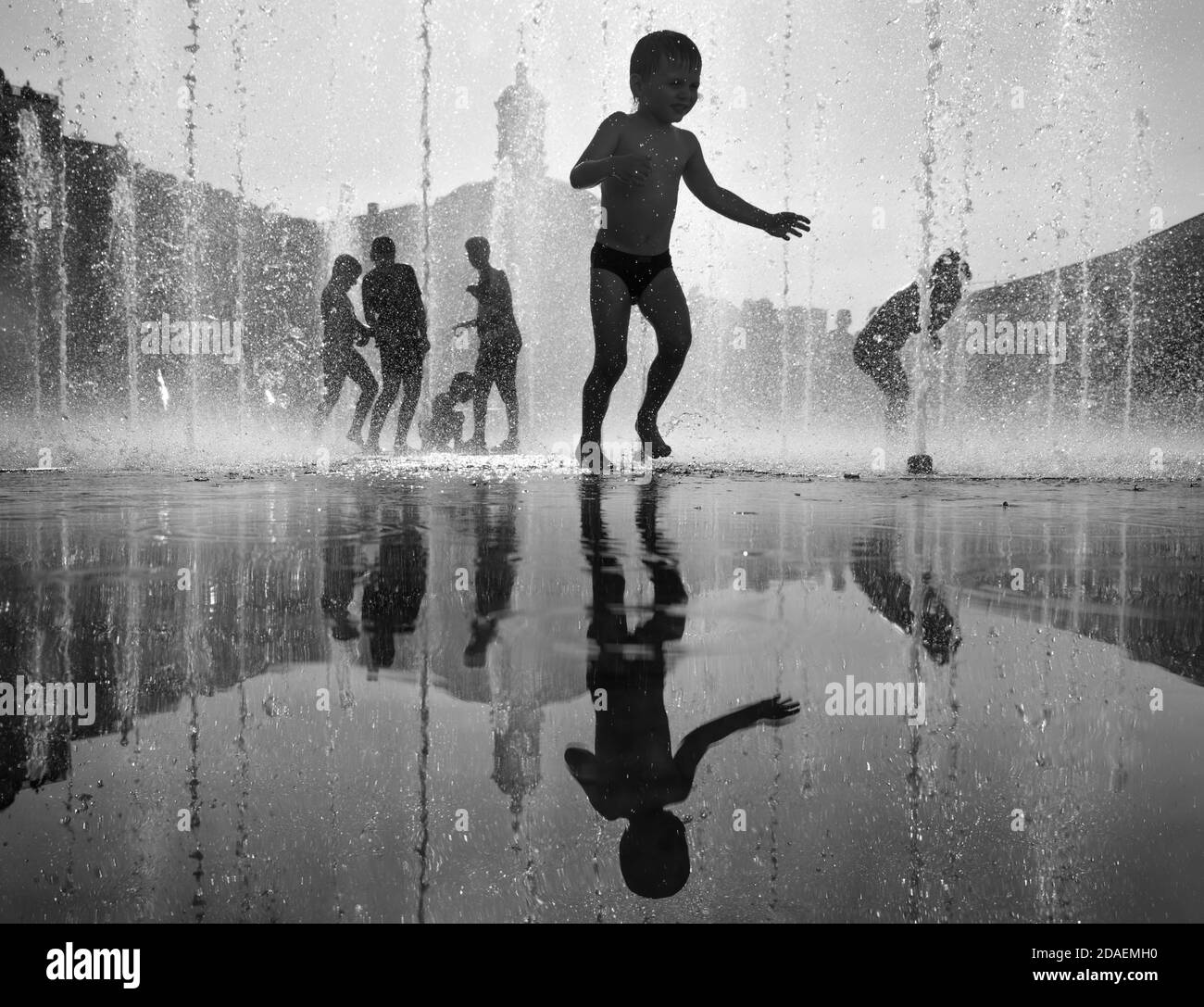 KIEV, UKRAINE - Jun 28, 2017: Happy children playing in a water ...