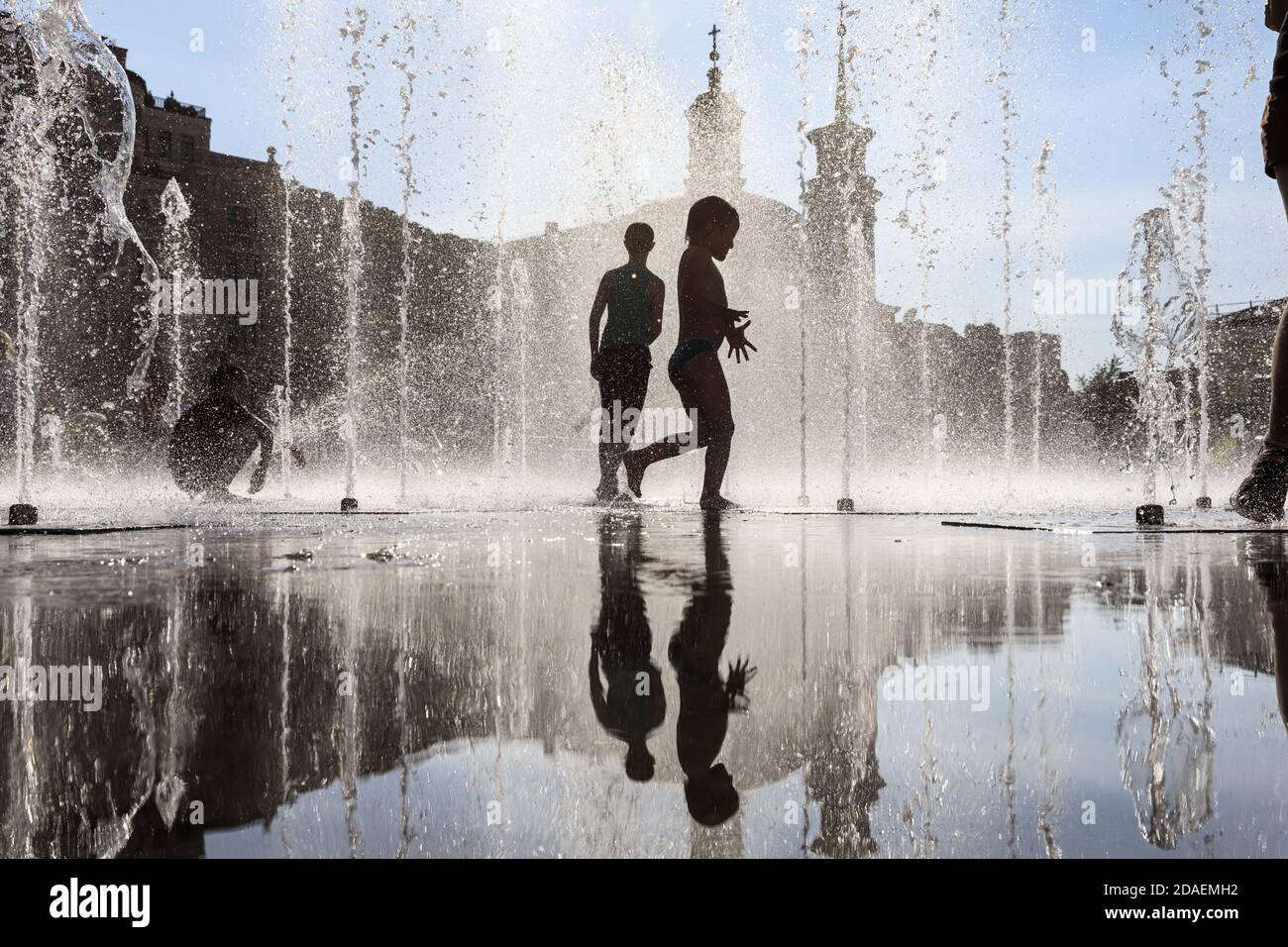 KIEV, UKRAINE - Jun 28, 2017: Happy children playing in a water ...
