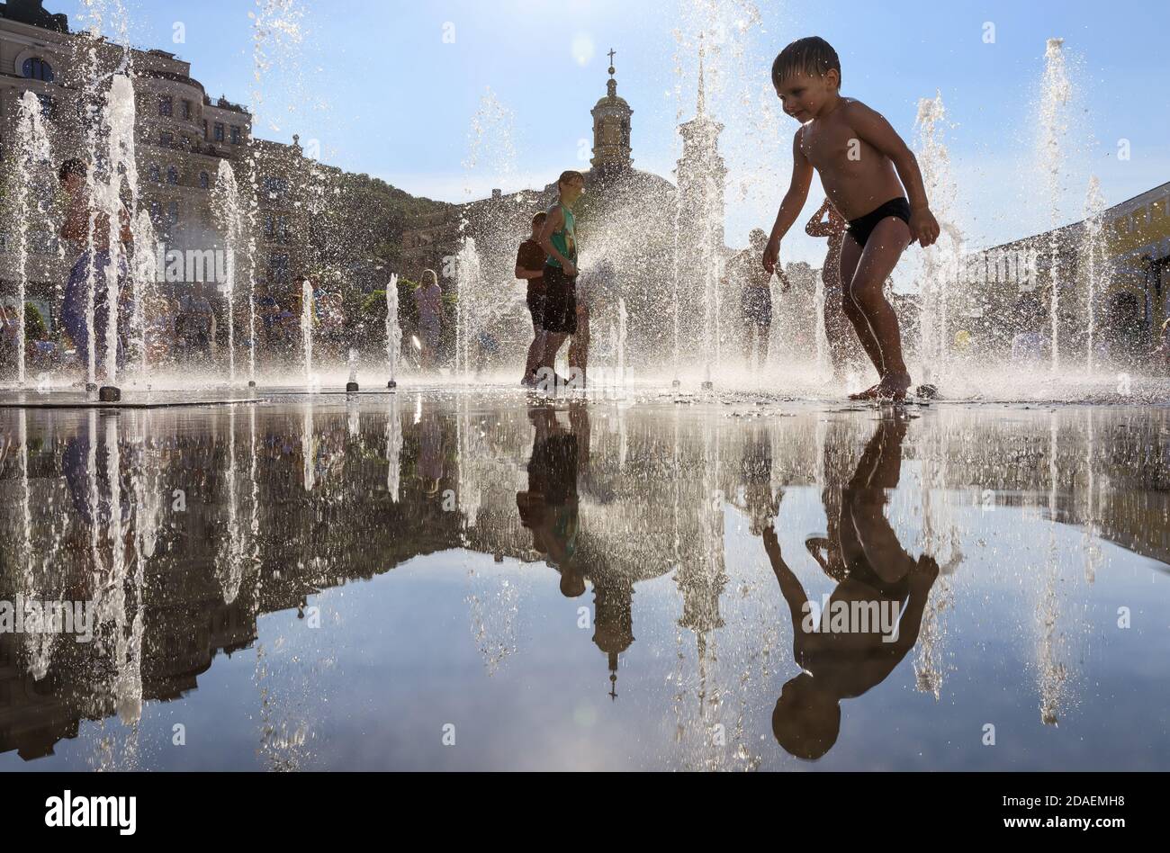 KIEV, UKRAINE - Jun 28, 2017: Happy children playing in a water ...