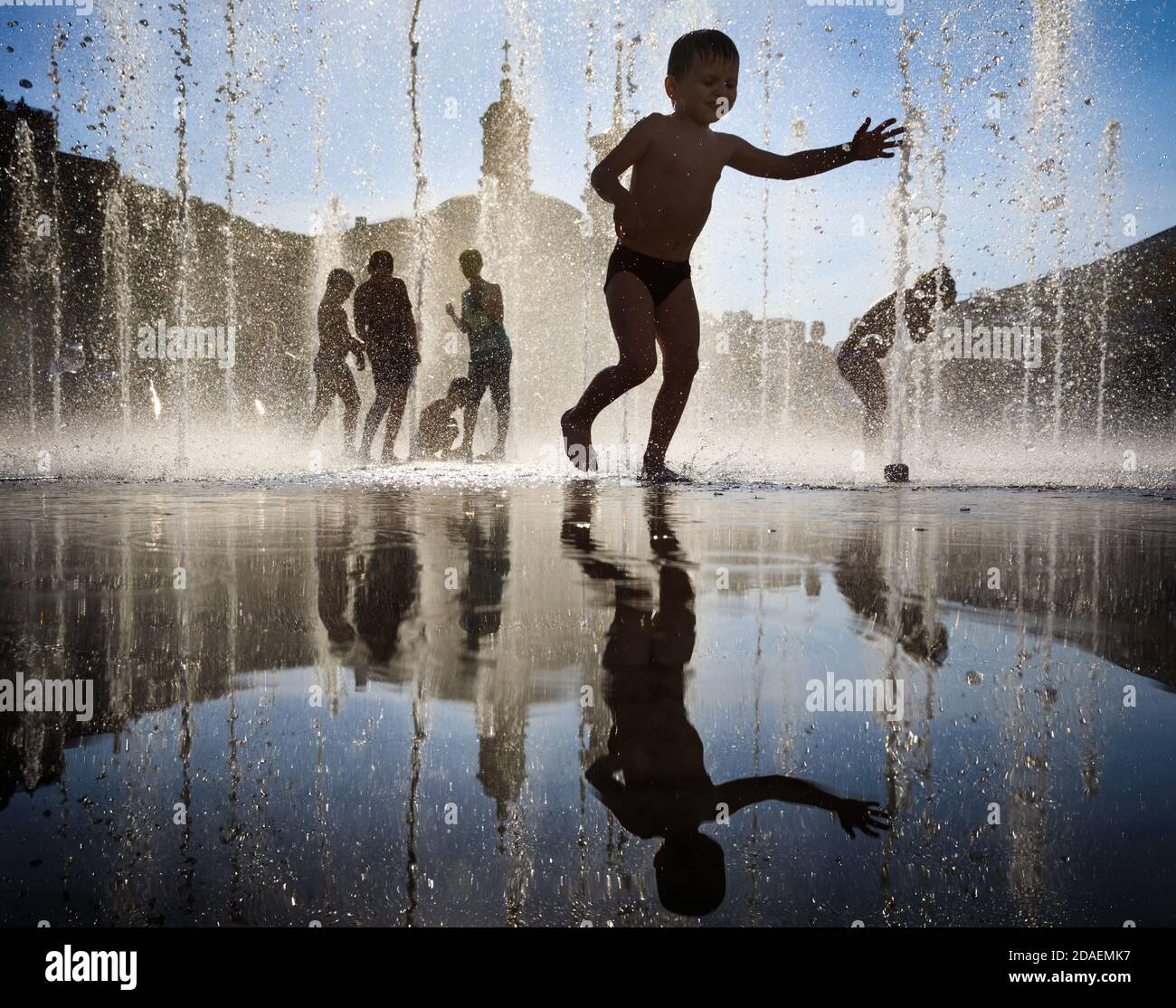 KIEV, UKRAINE - Jun 28, 2017: Happy children playing in a water ...