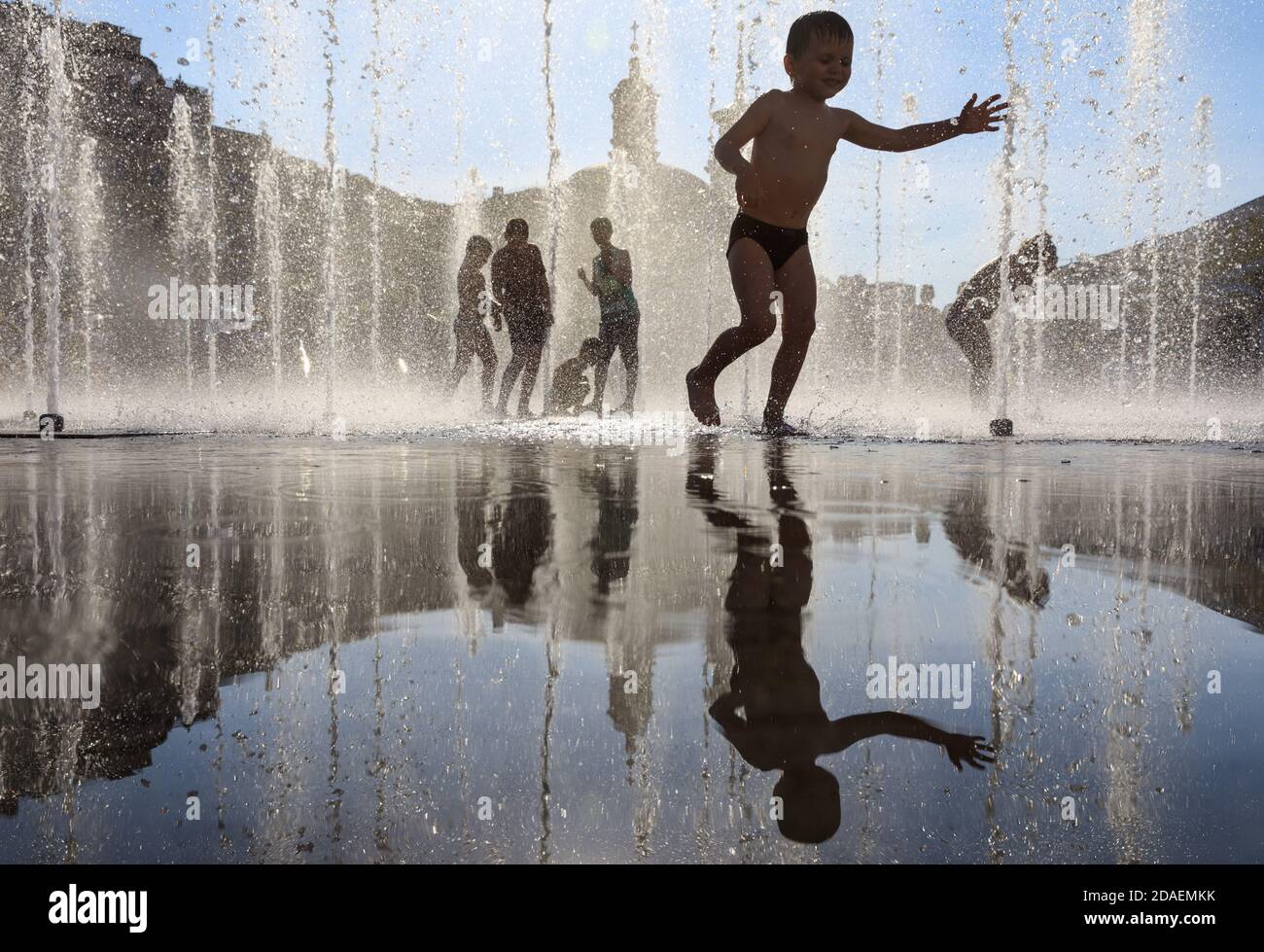 KIEV, UKRAINE - Jun 28, 2017: Happy children playing in a water ...