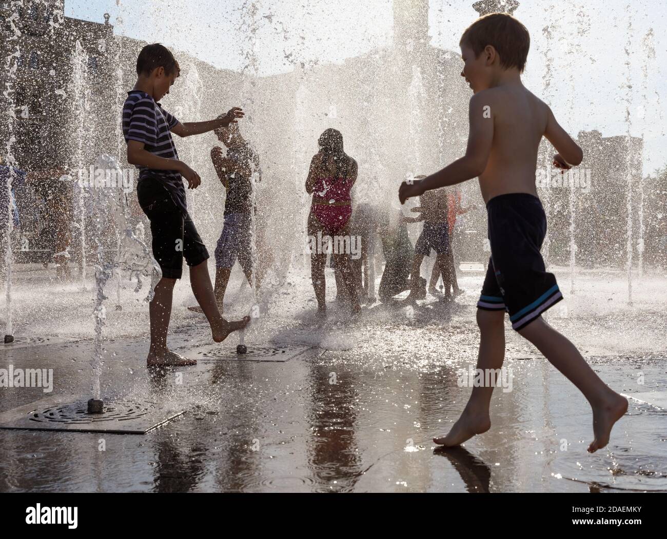 KIEV, UKRAINE - Jun 28, 2017: Happy children playing in a water ...