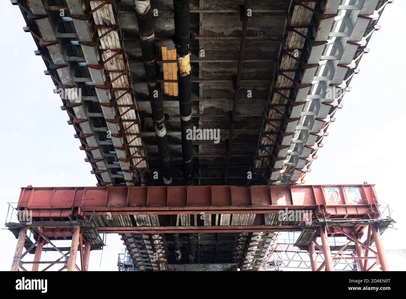 Old concrete bridge. Rust Coated Pipes and Utilities Stock Photo - Alamy