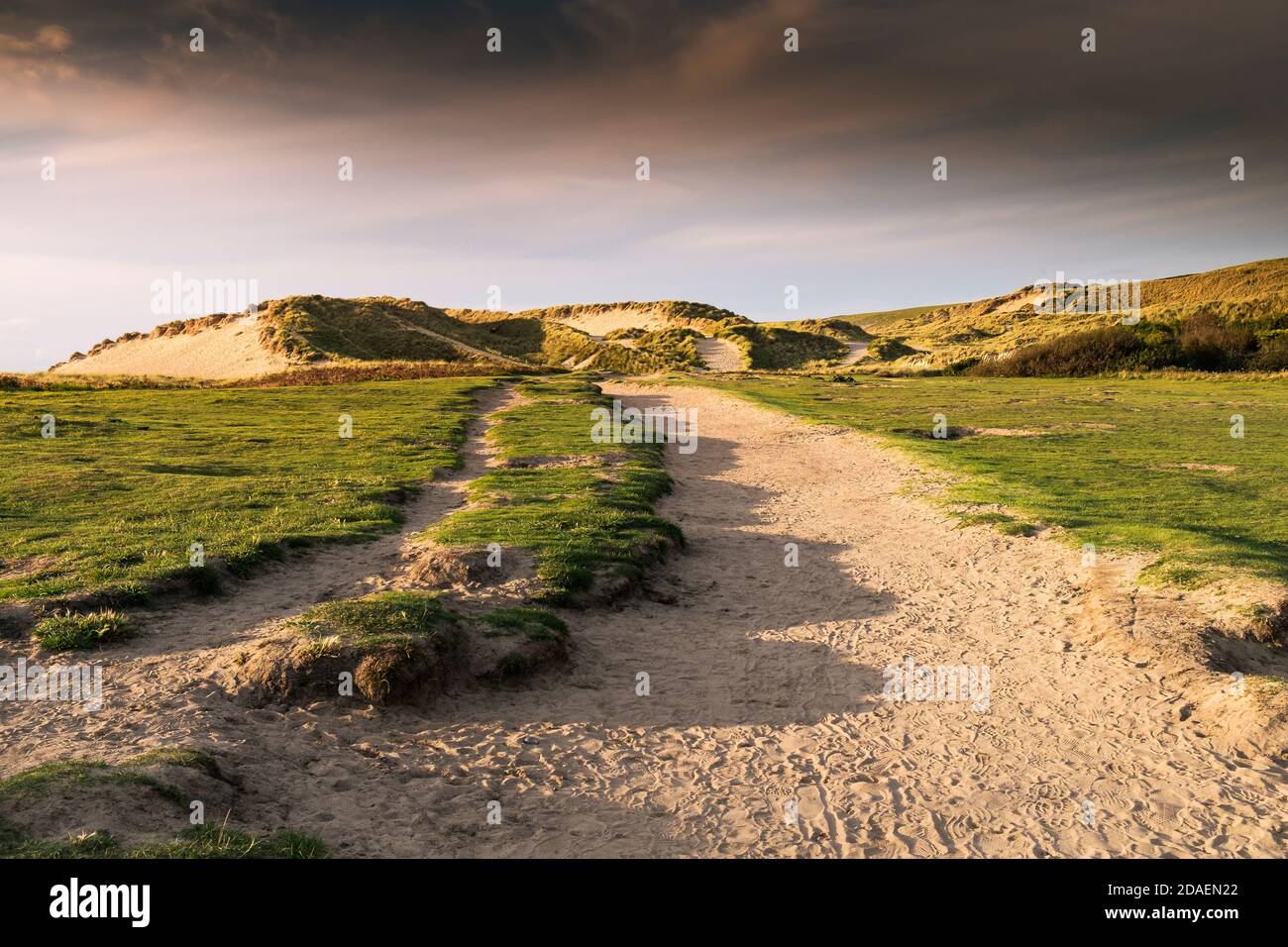 A sandy footpath leading to the sand dune system at Holywell in ...