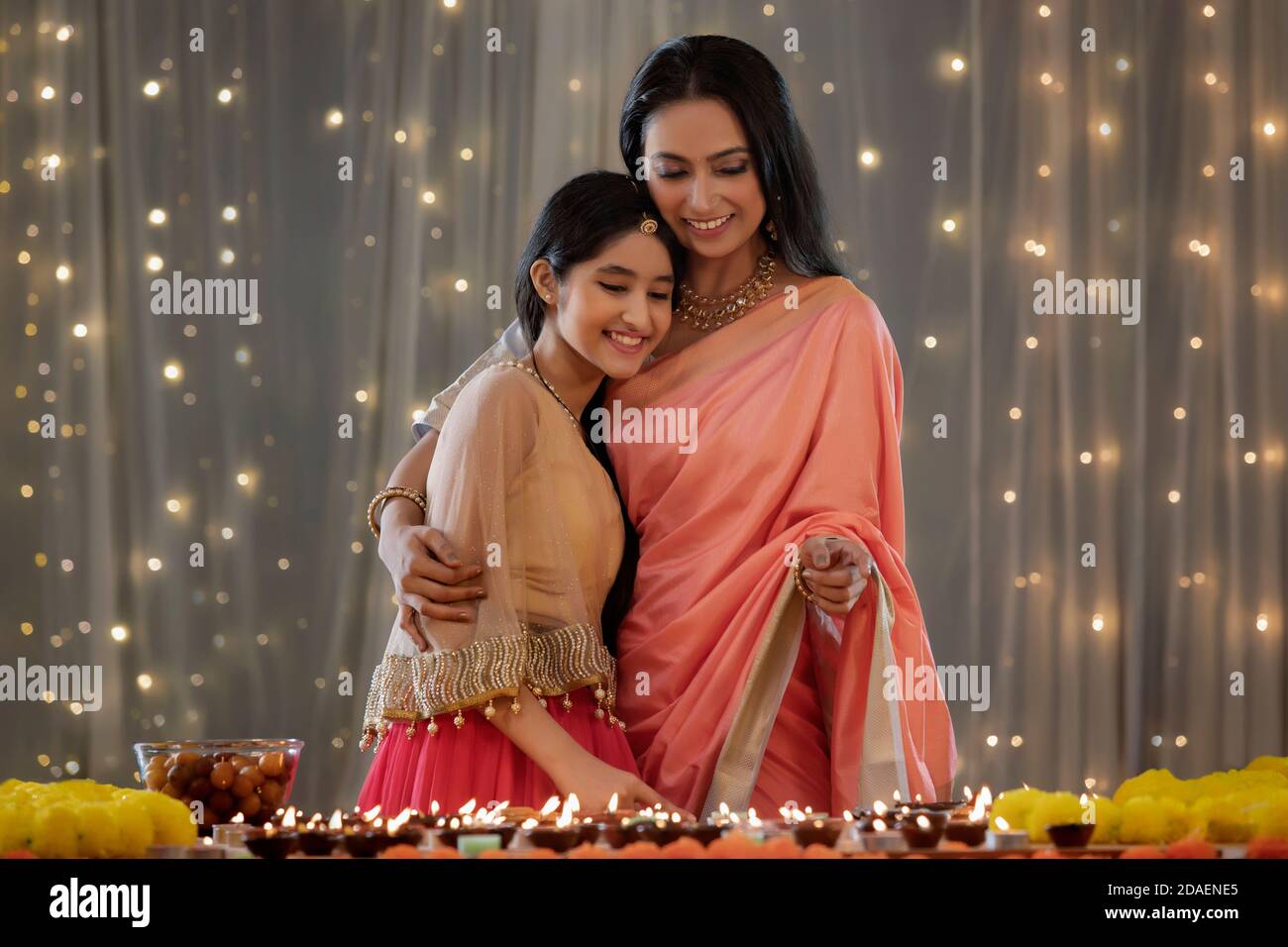 Mother and daughter standing together happily Stock Photo - Alamy